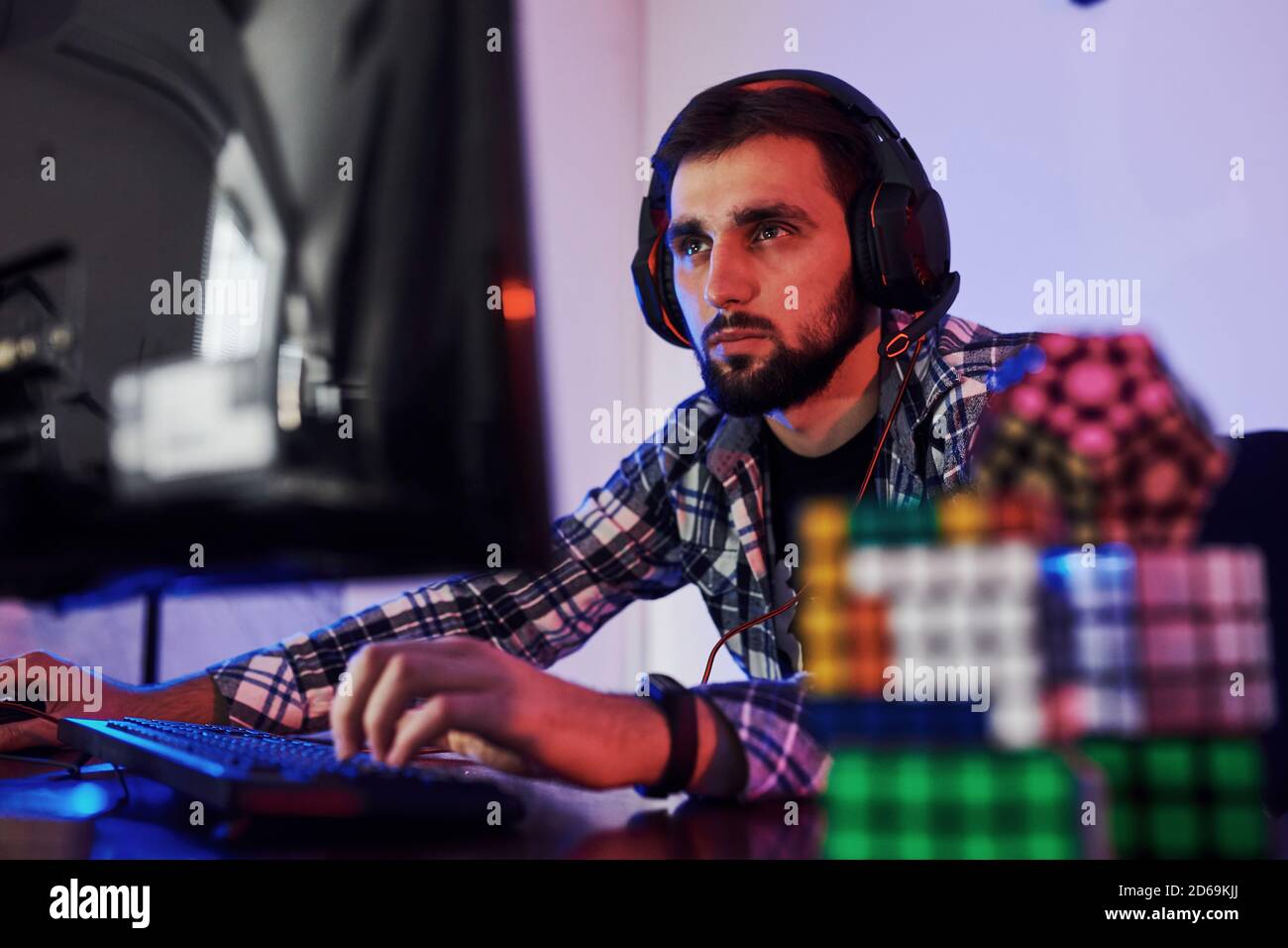 Portrait of young bearded pro gamer playing in online video game Stock ...