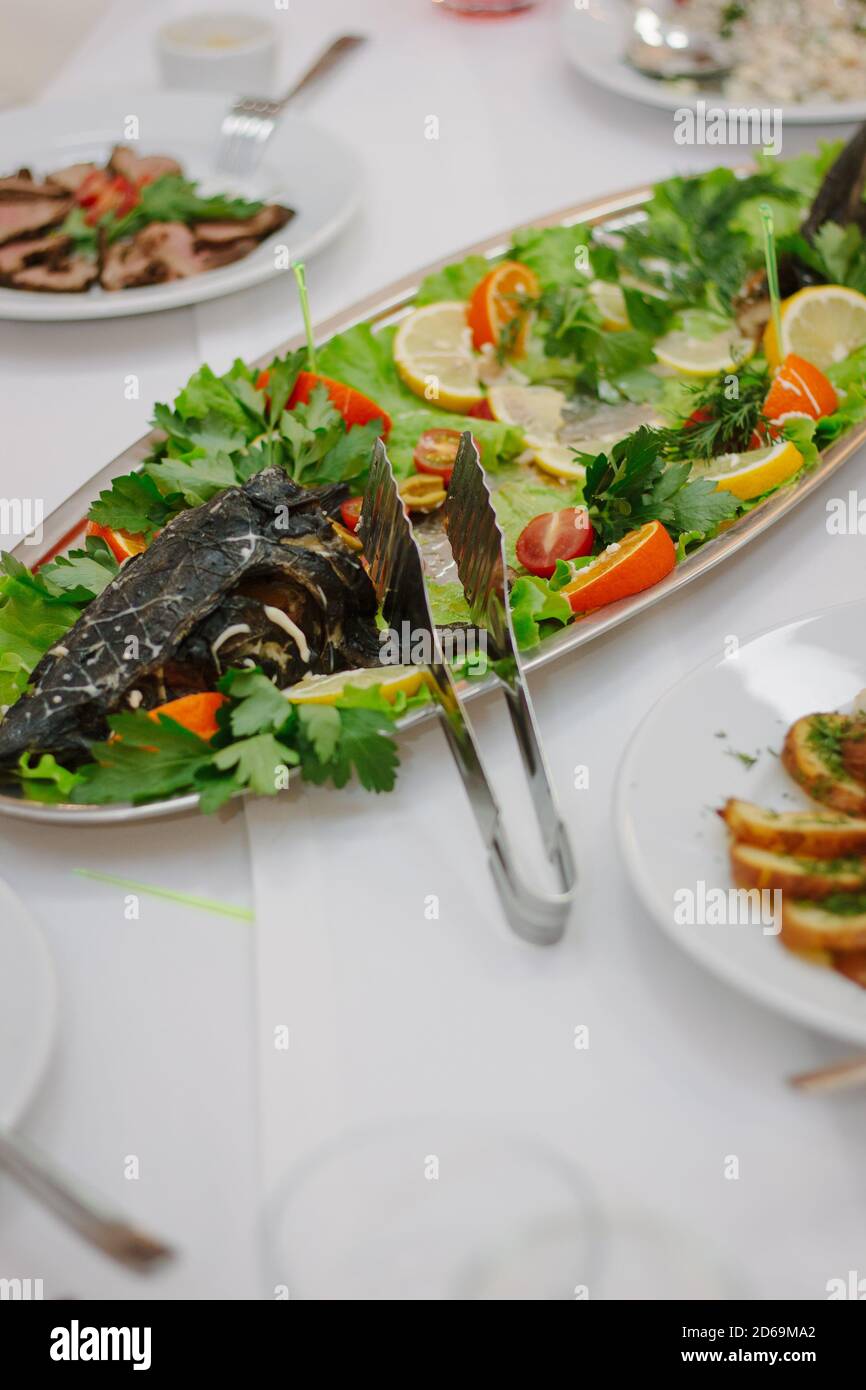 Big fish on table during catering event. Catering buffet Stock Photo ...