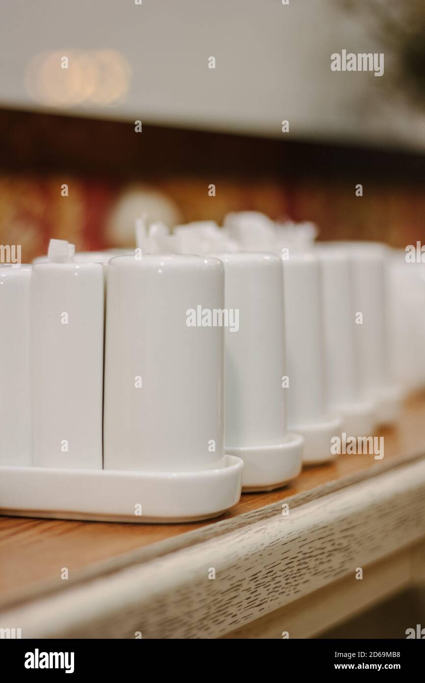 Row of salt shakers at restaurant during dinner Stock Photo - Alamy