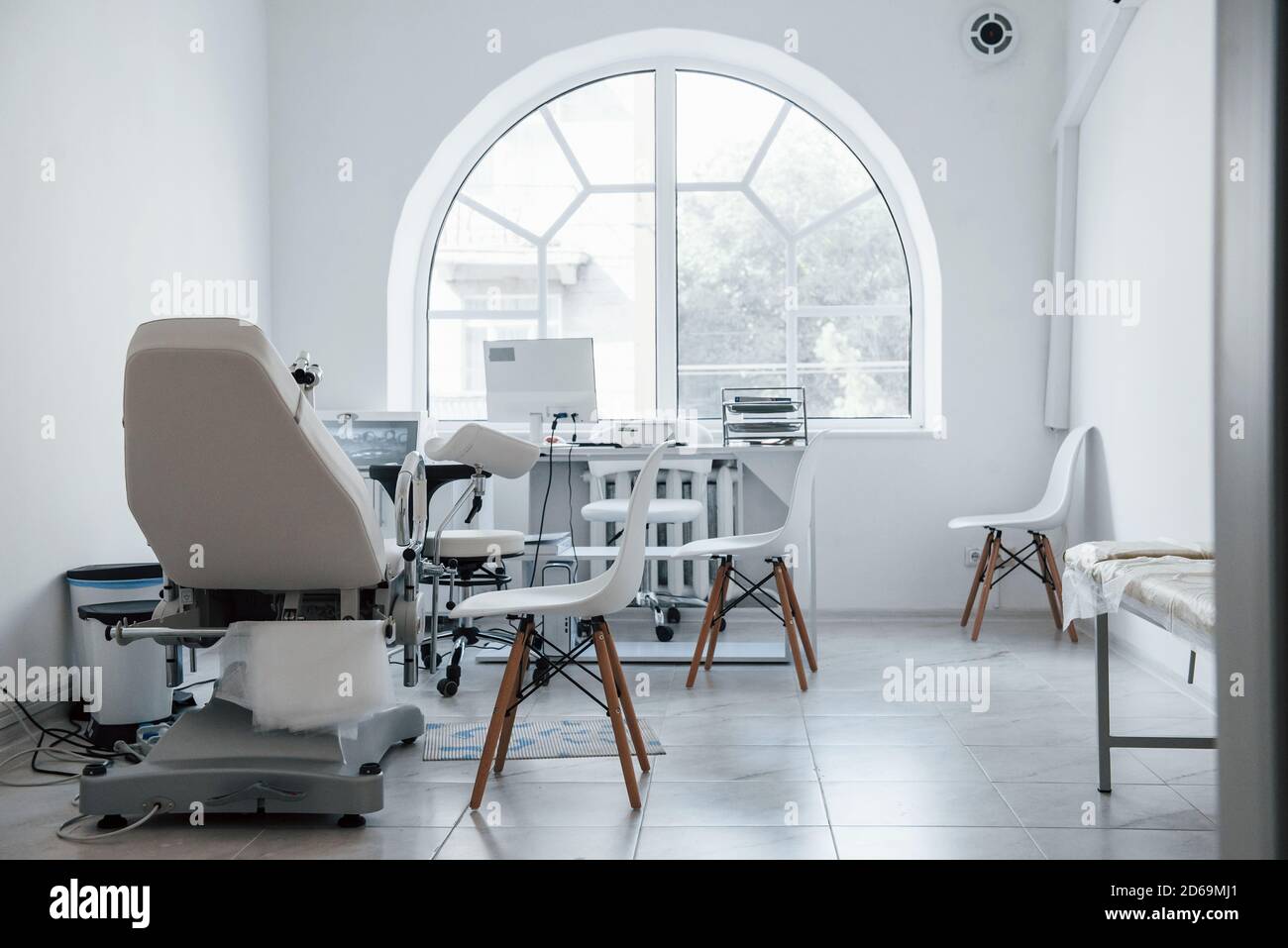 Interior of obstetric clinic cabinet indoors with computer and bed ...