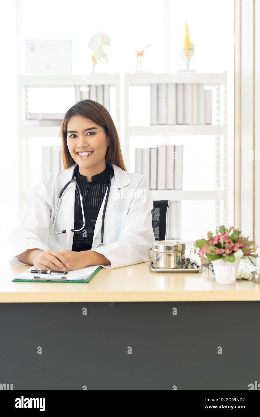 Portrait confident female doctor medical professional sitting in ...