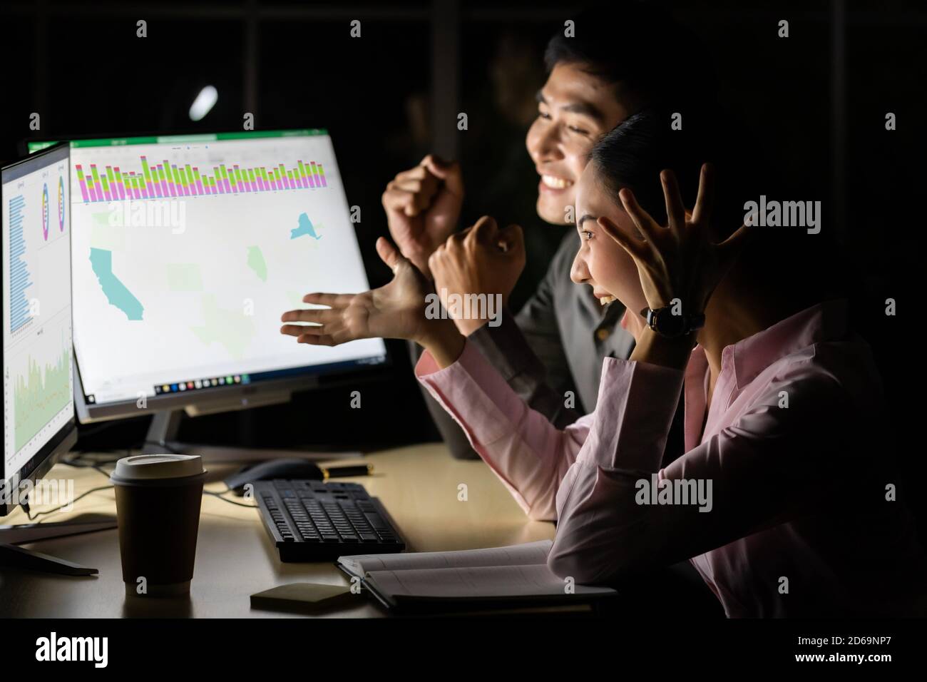 Attractive cheerful glad coworkers gathering celebrating successful ...