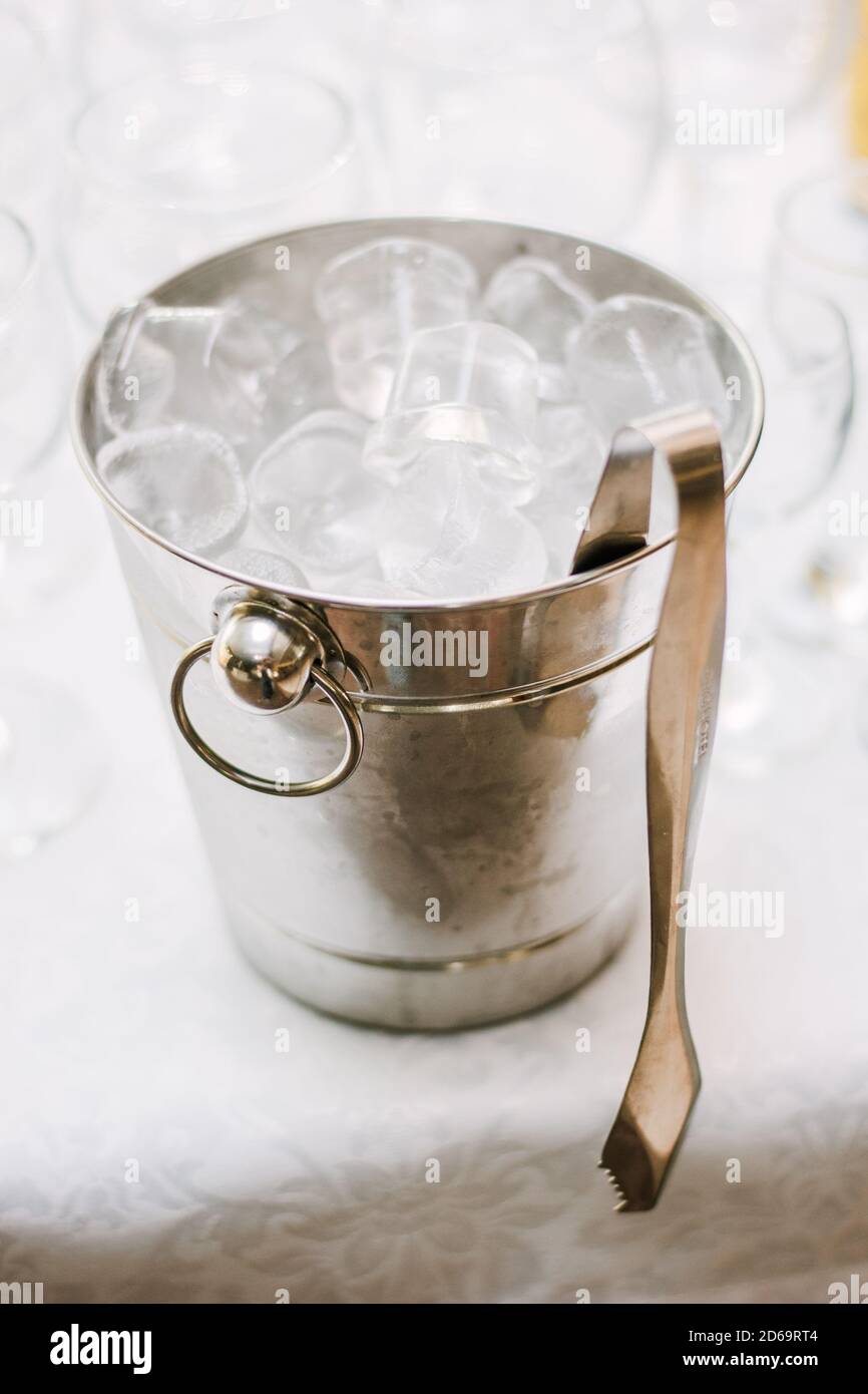 Cold ice in a bucket. Ice Bucket with tranparent cubes of ice Stock ...