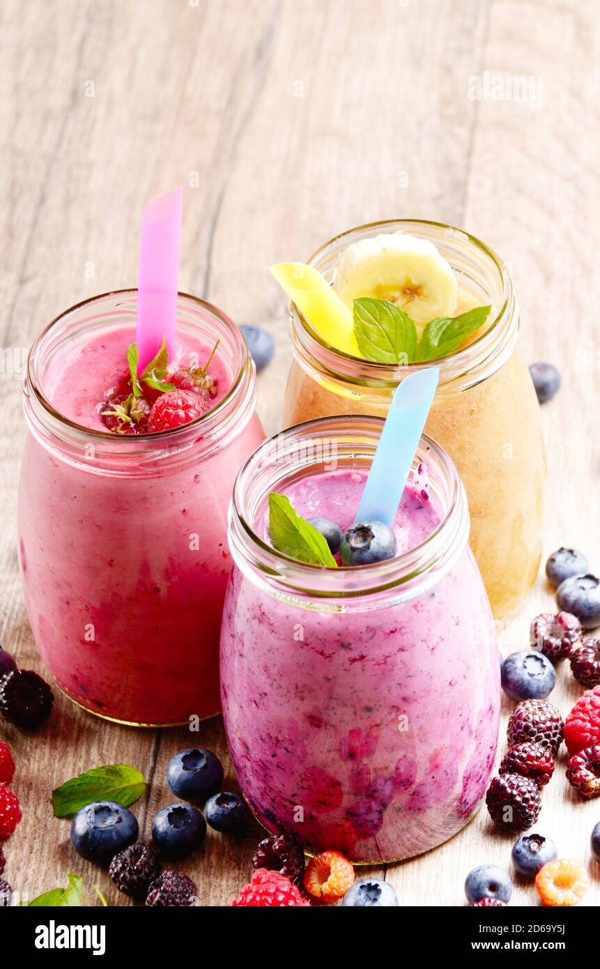Assorted fruit shakes on white table. Smoothie concept Stock Photo - Alamy