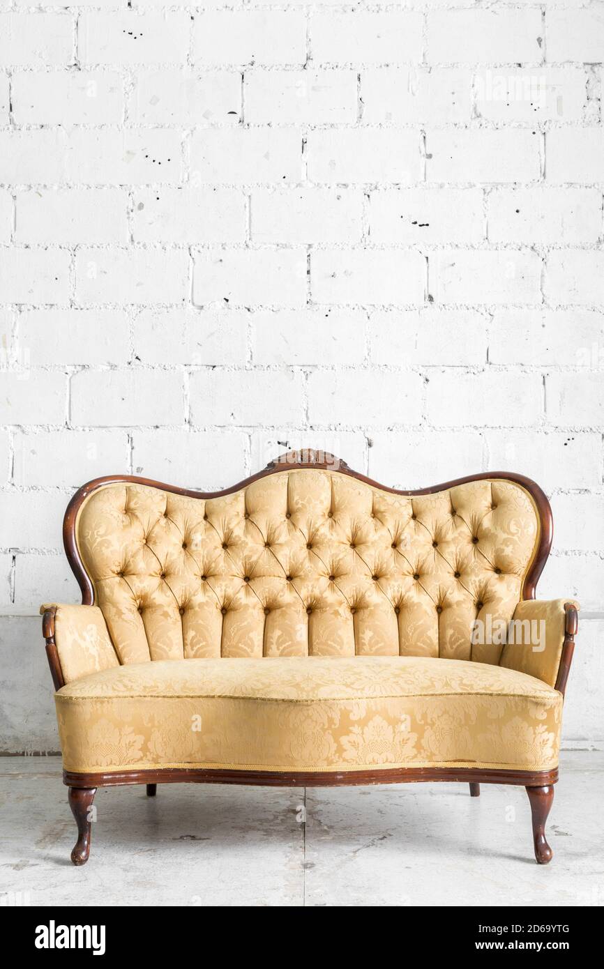 Brown Retro classical style sofa couch in vintage room Stock Photo - Alamy