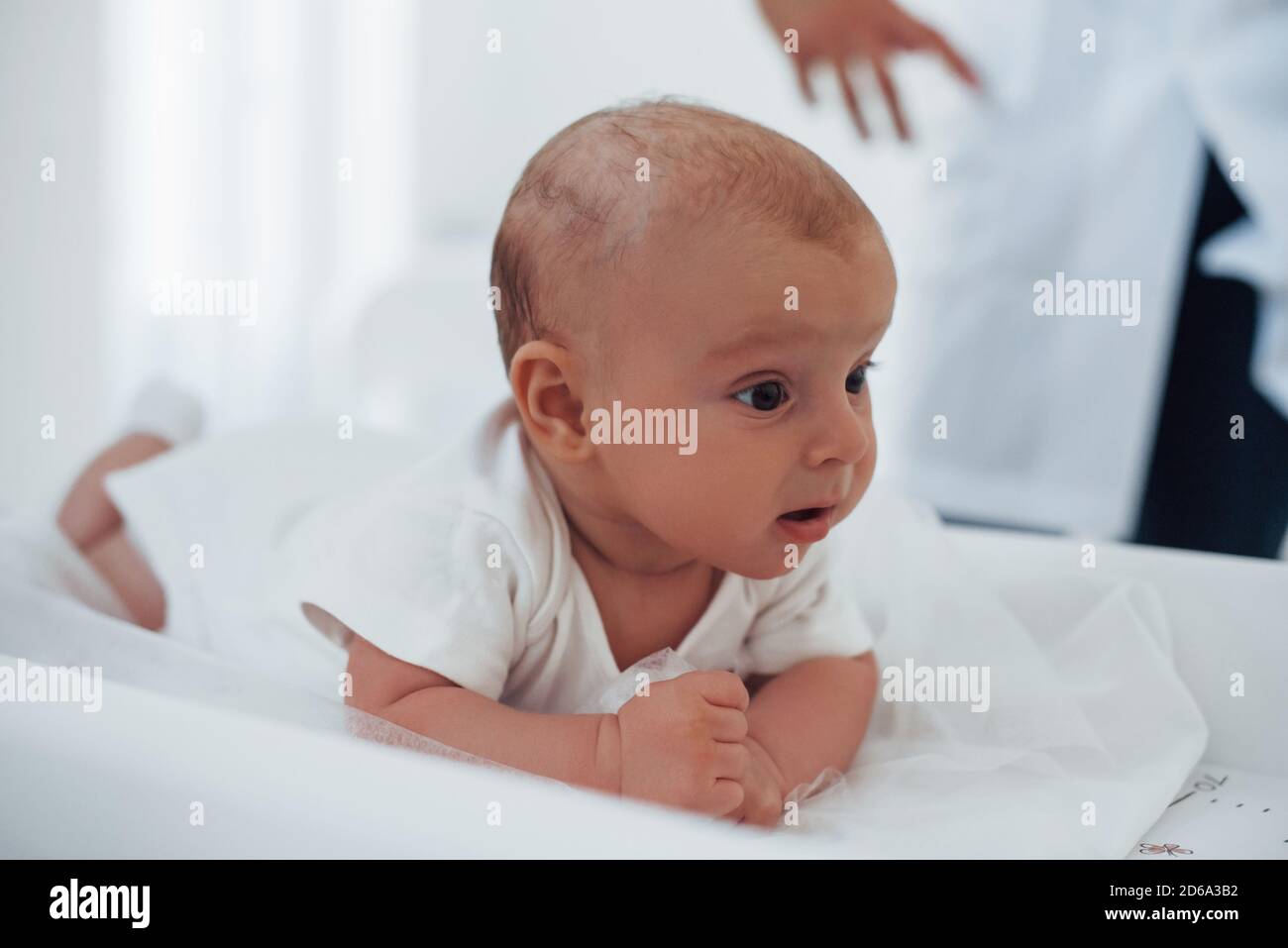 Patient lying down on an examination table hi-res stock photography and ...