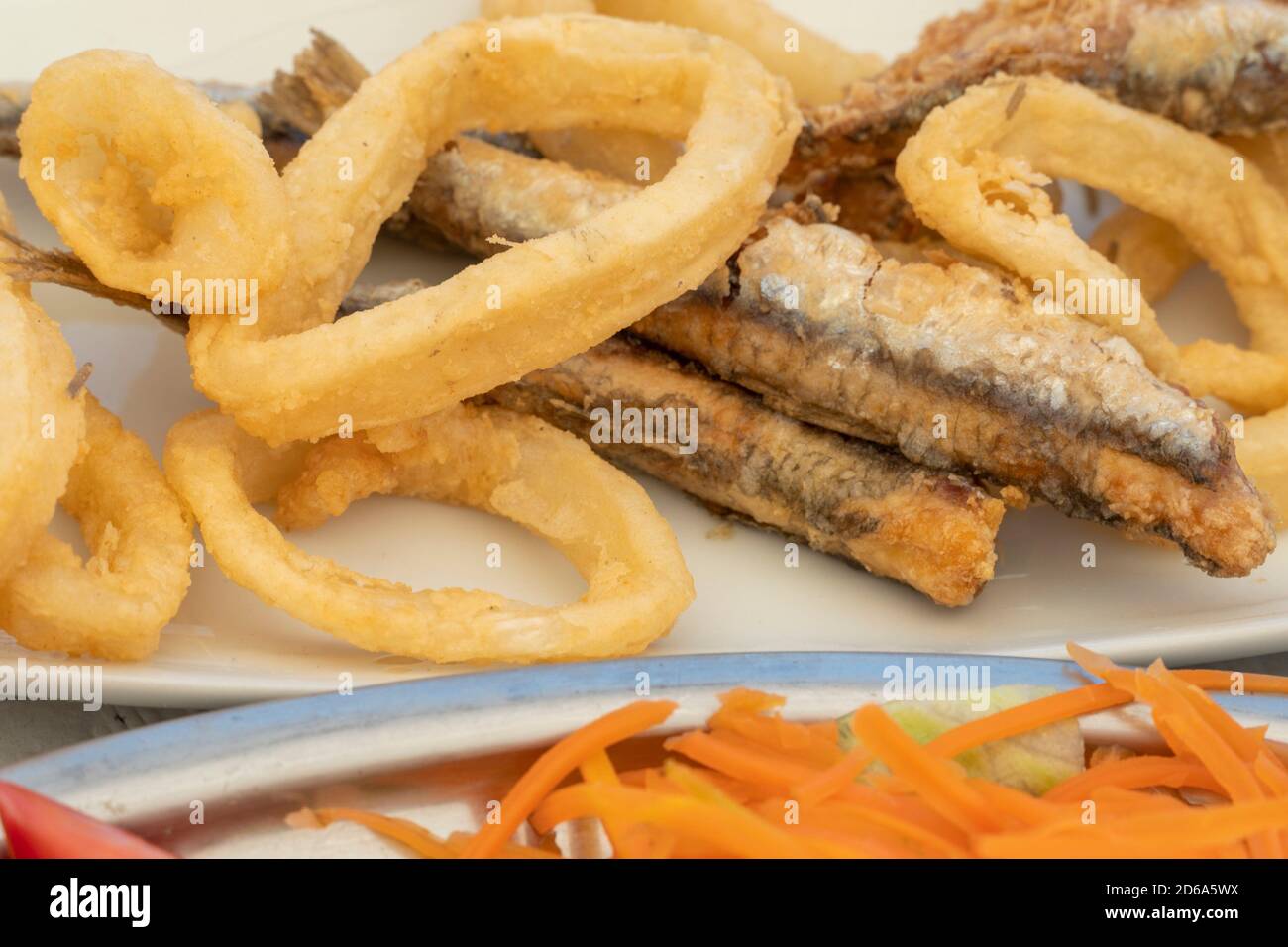 Deep fried calamari and fishes in chiringuito Spain Stock Photo - Alamy