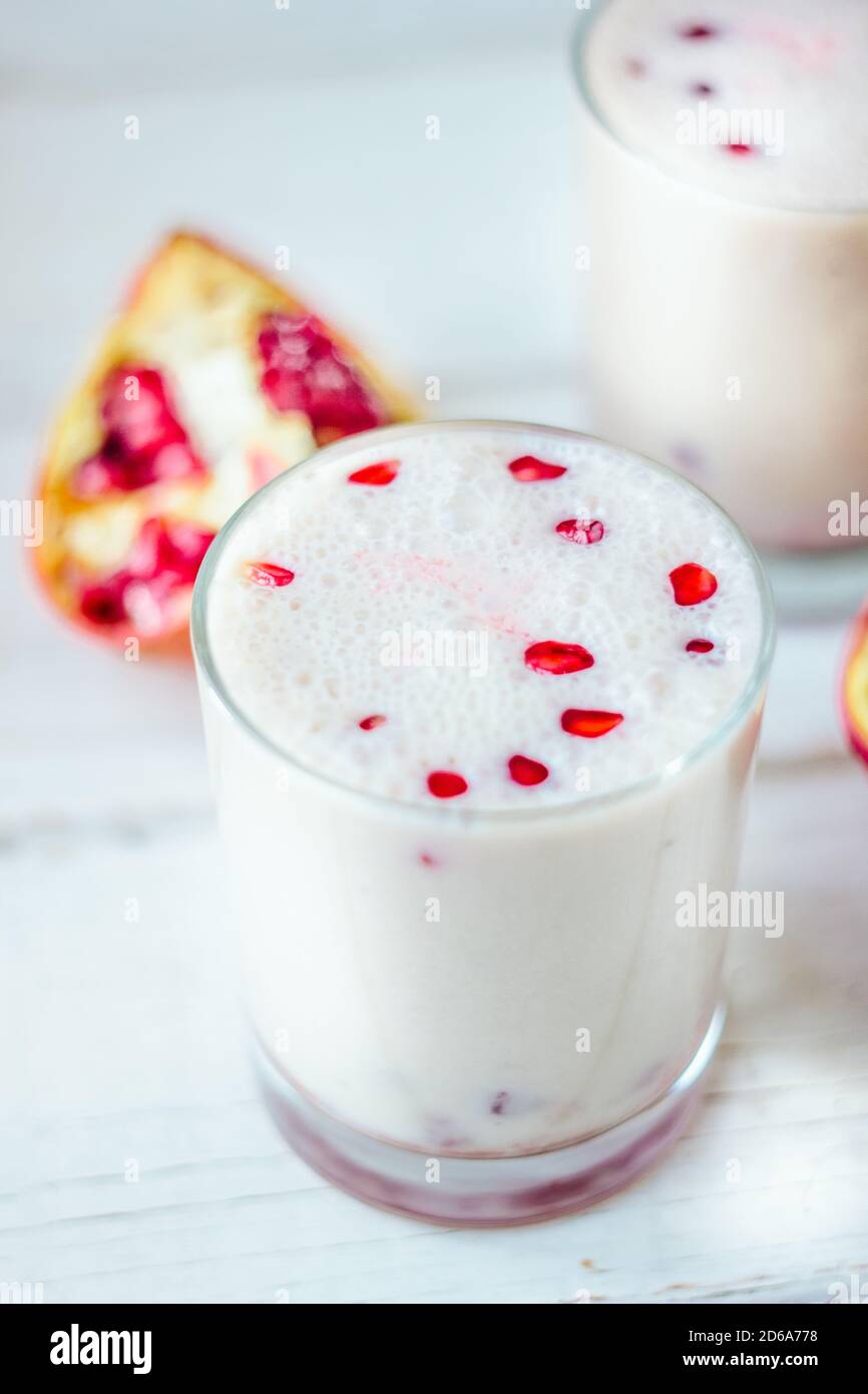 Traditional indian lassi - cold yougurt drink on white table with ...