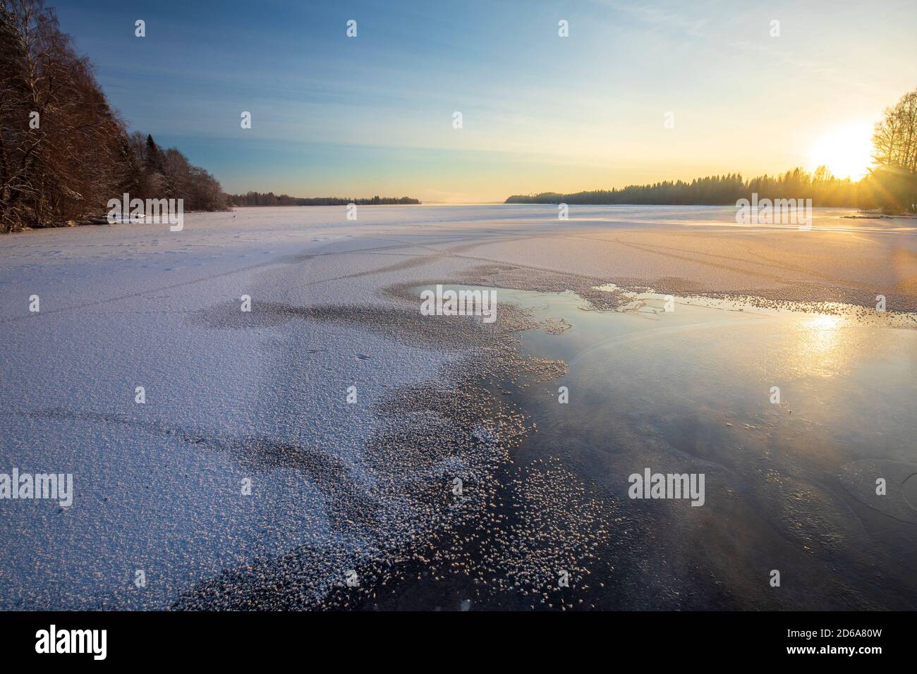 Lake freezing over at Winter , Finland Stock Photo - Alamy