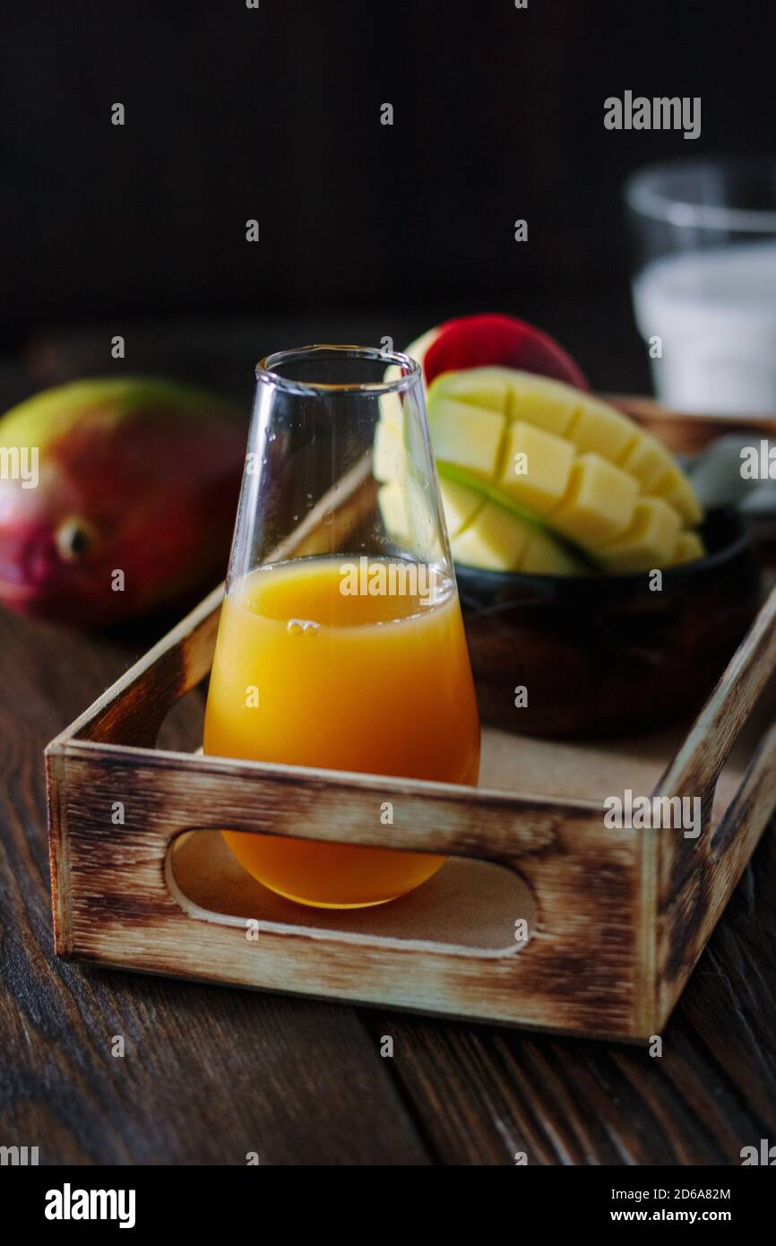 Mango juice in transparent glass juice hi-res stock photography and ...
