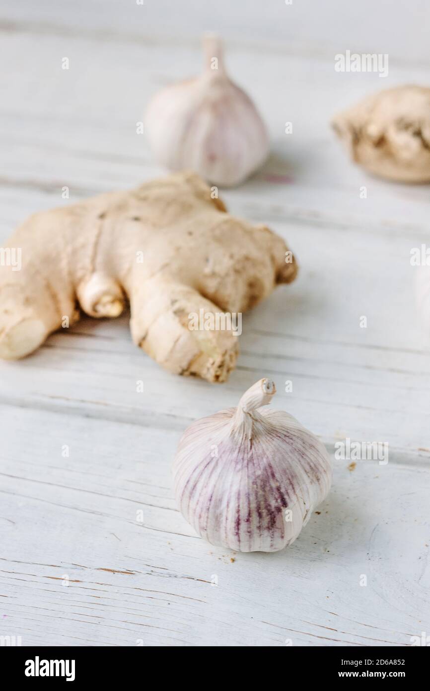 Garlic and ginger on white wooden surface Stock Photo - Alamy