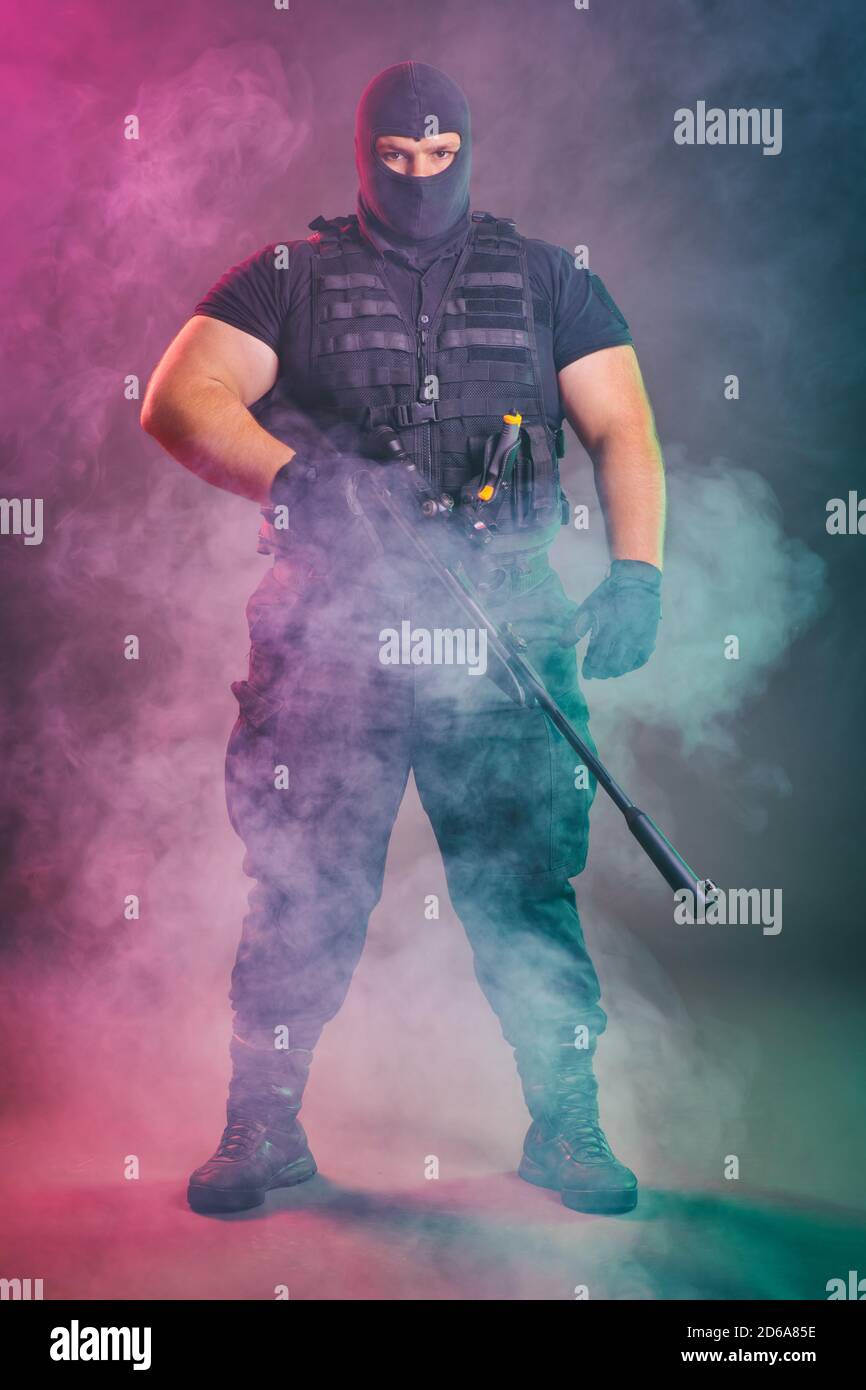 Soldier comes out of the smoke on the battlefield. The concept of ...