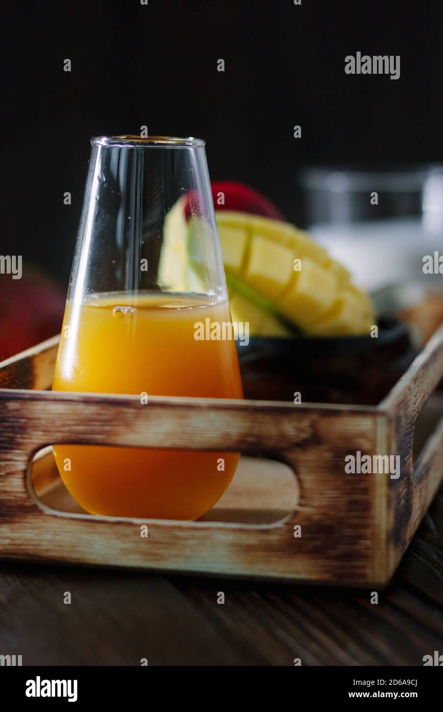 Mango juice in transparent glass juice hi-res stock photography and ...