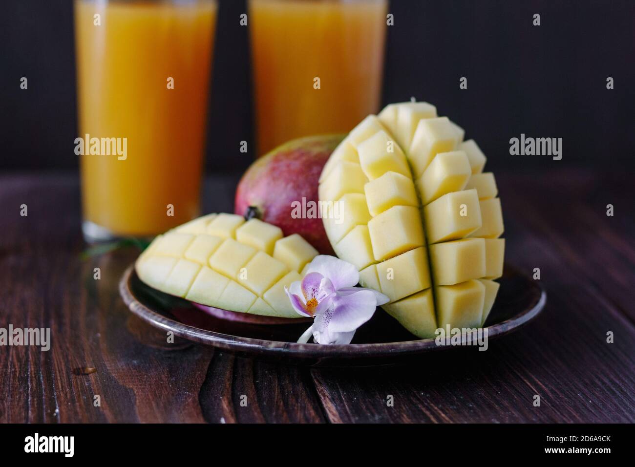 Mango fruits over wooden table as healthy food concept Stock Photo - Alamy