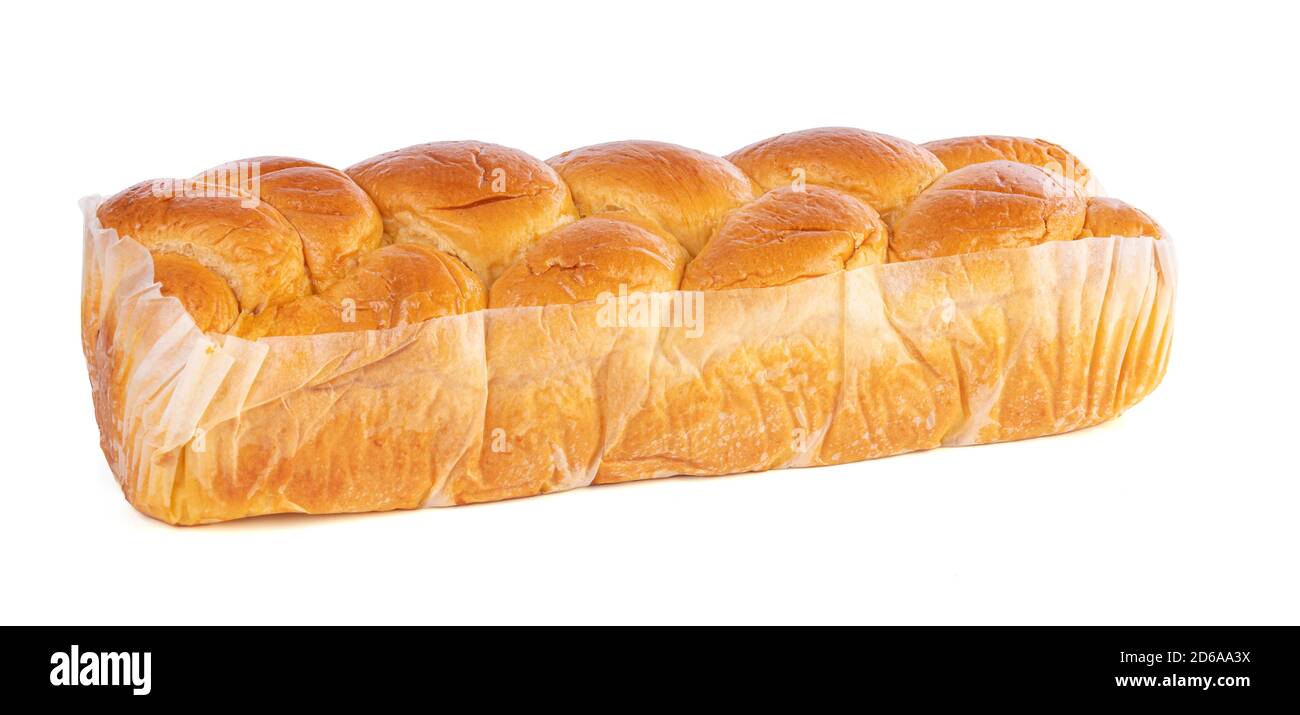 A braided brioche in its paper packaging on a white background Stock ...