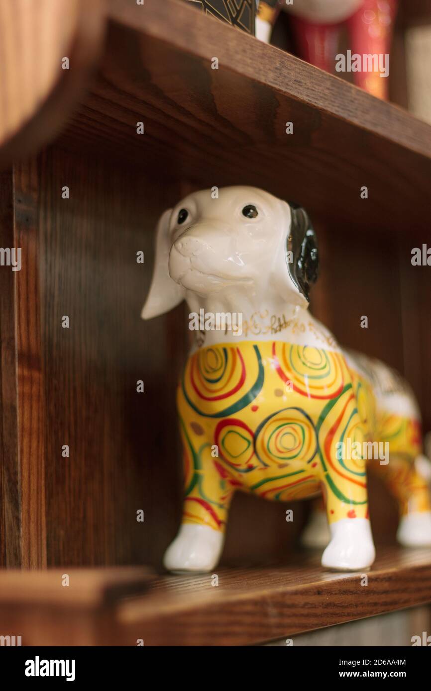 Statue of dog on wooden background as interior design element Stock ...