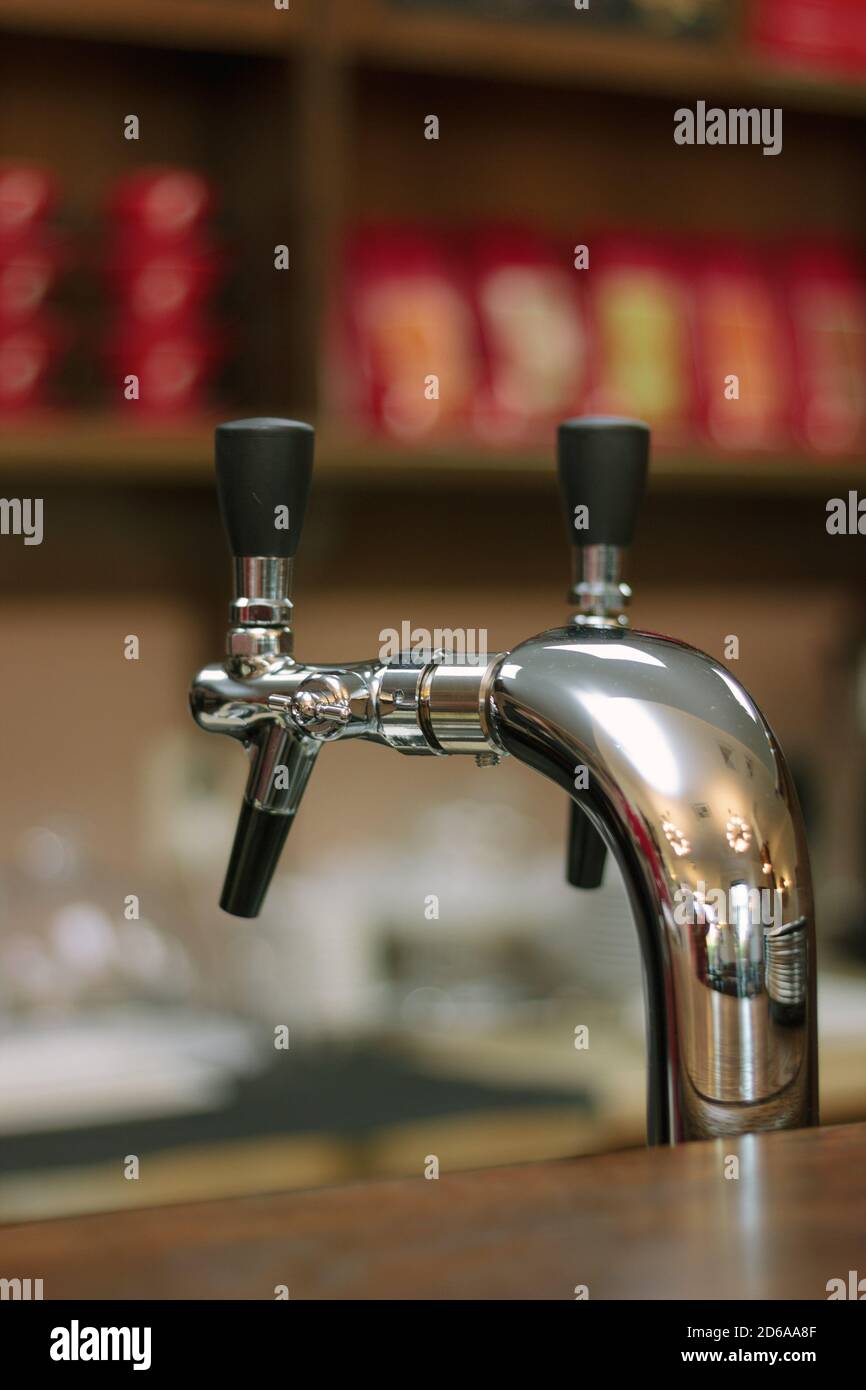 Beer spigot on bar, ready to filling beer Stock Photo - Alamy