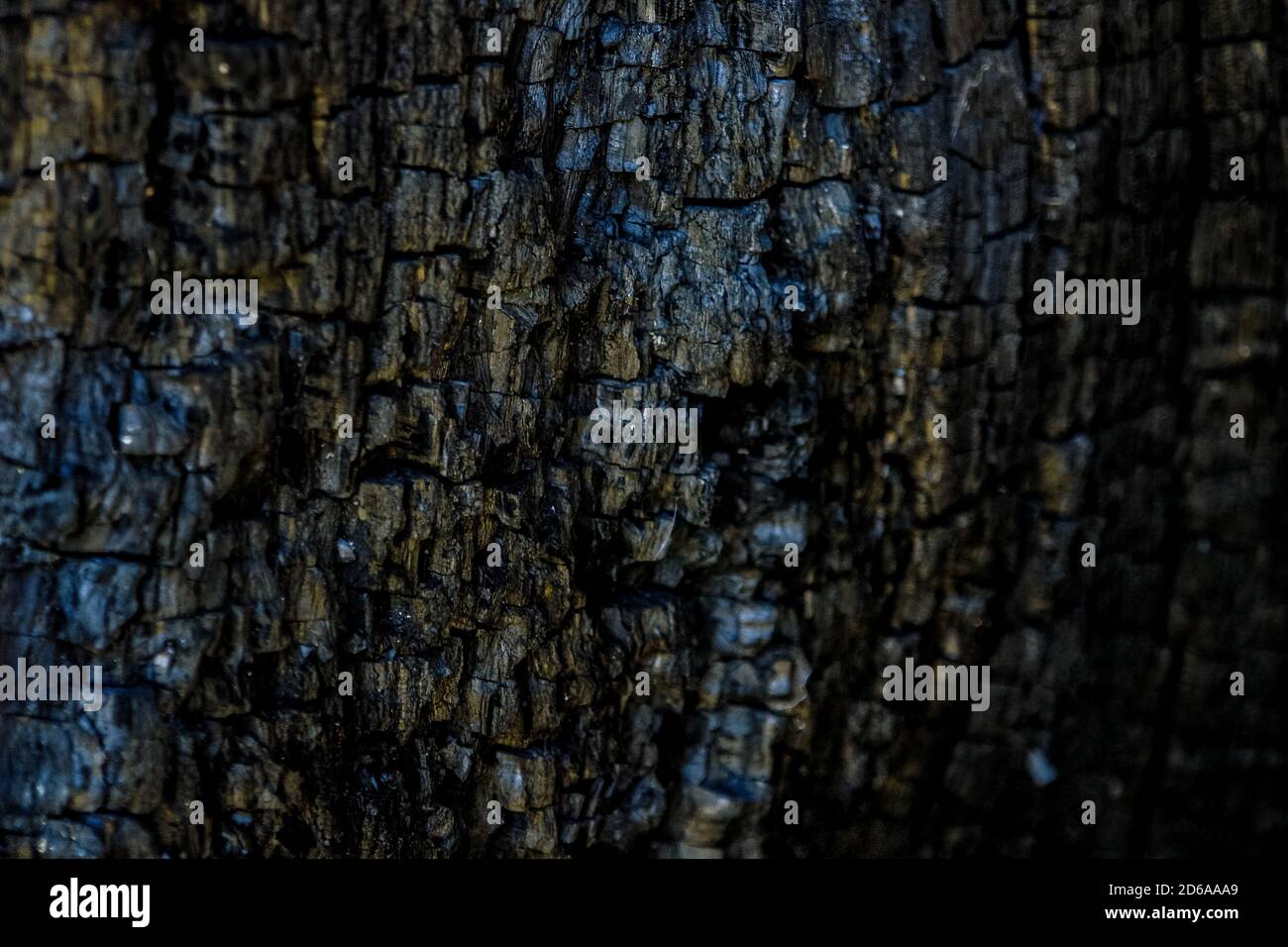 Black burnt wooden surface background. Dark ash and cinder surface ...