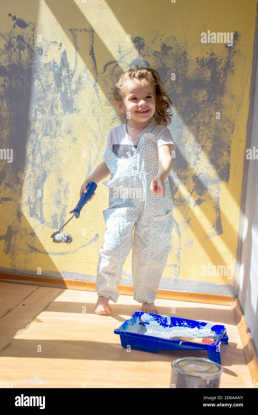 Little kid girl helping making renovation at house room Stock Photo - Alamy