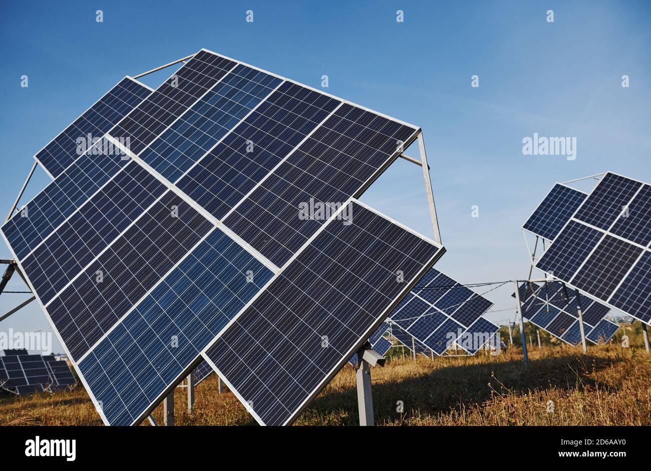 Field with solar batteries at sunny daytime. Conception of ecology and ...