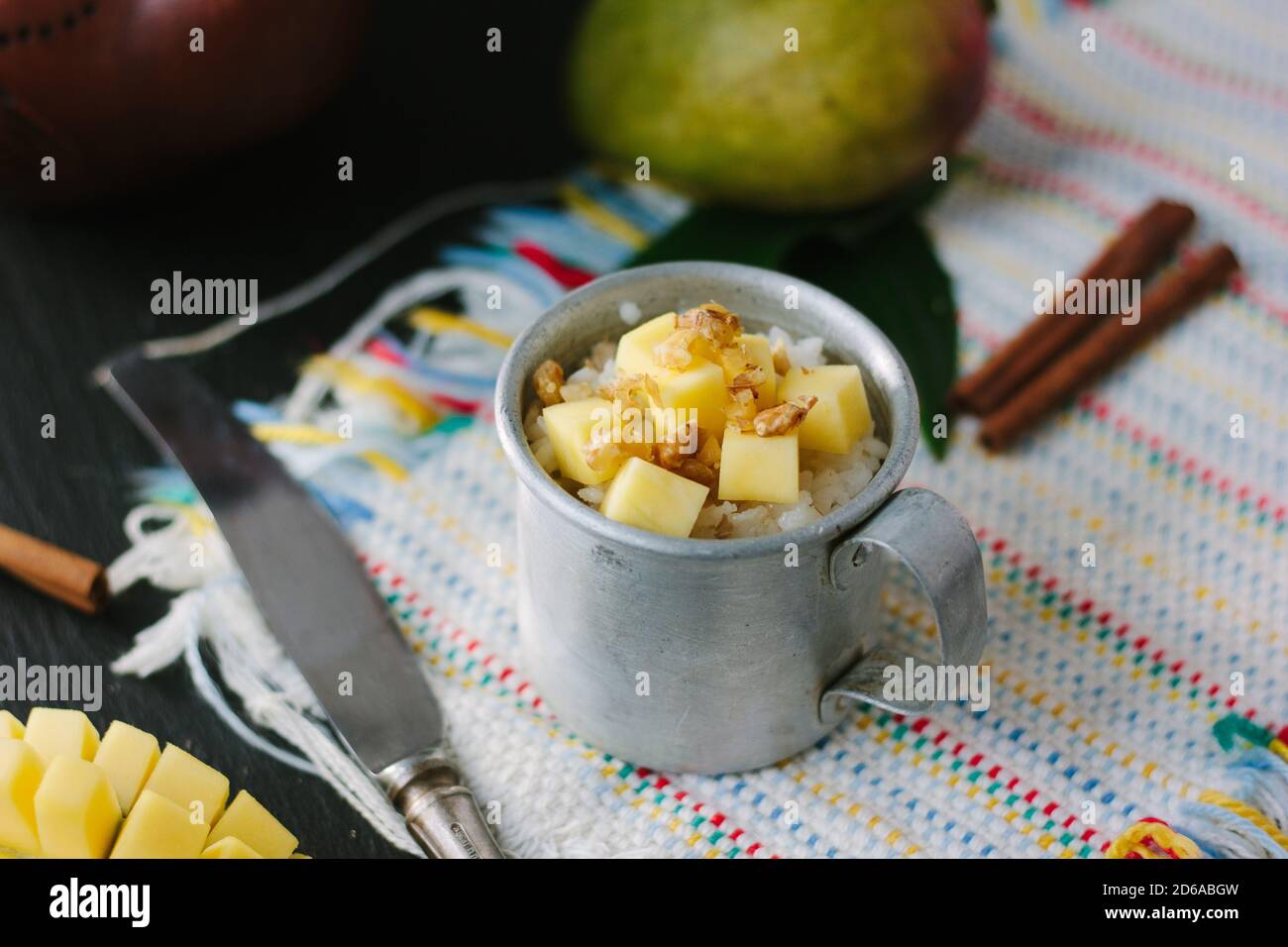 Sticky rice with mango fruit and nuts Stock Photo - Alamy