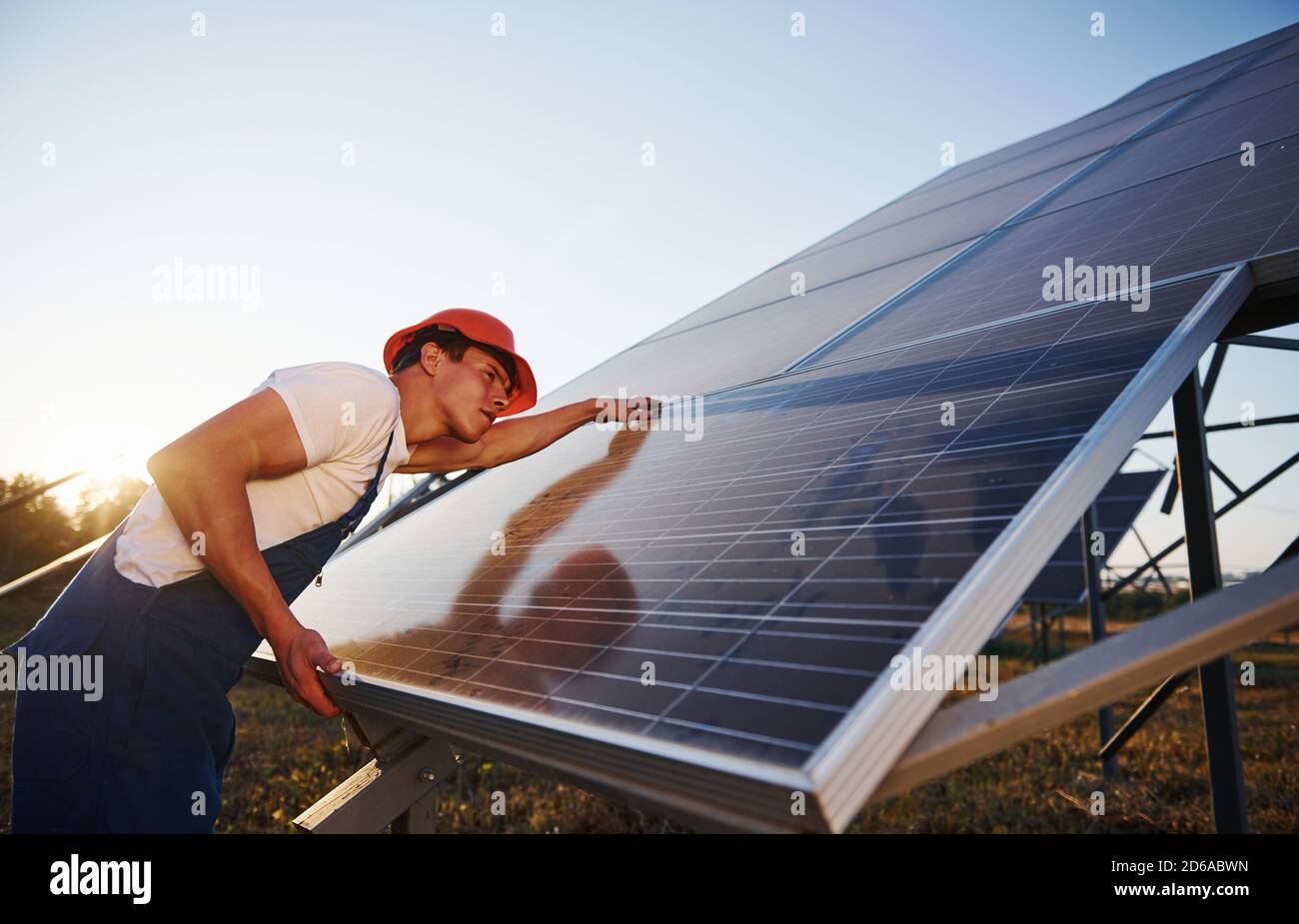 Male worker in blue uniform hi-res stock photography and images - Alamy