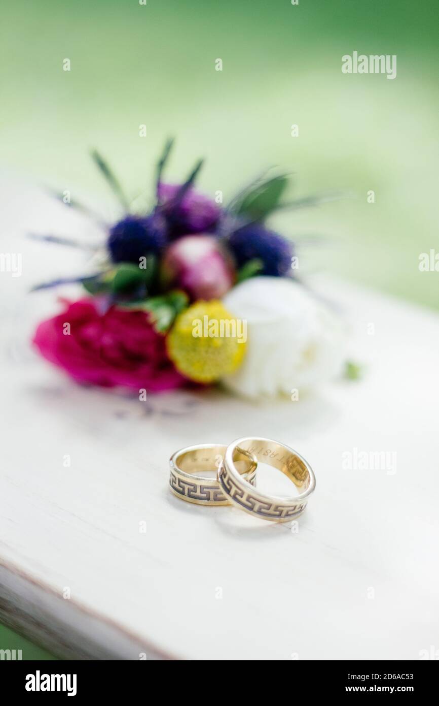 The wedding rings with flowers, marriage concept Stock Photo - Alamy