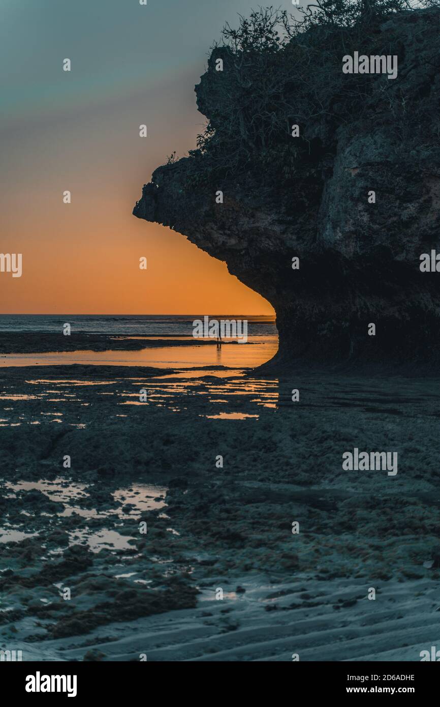 FIsherman fishing on a sunset beach at lifu lada beach Stock Photo - Alamy