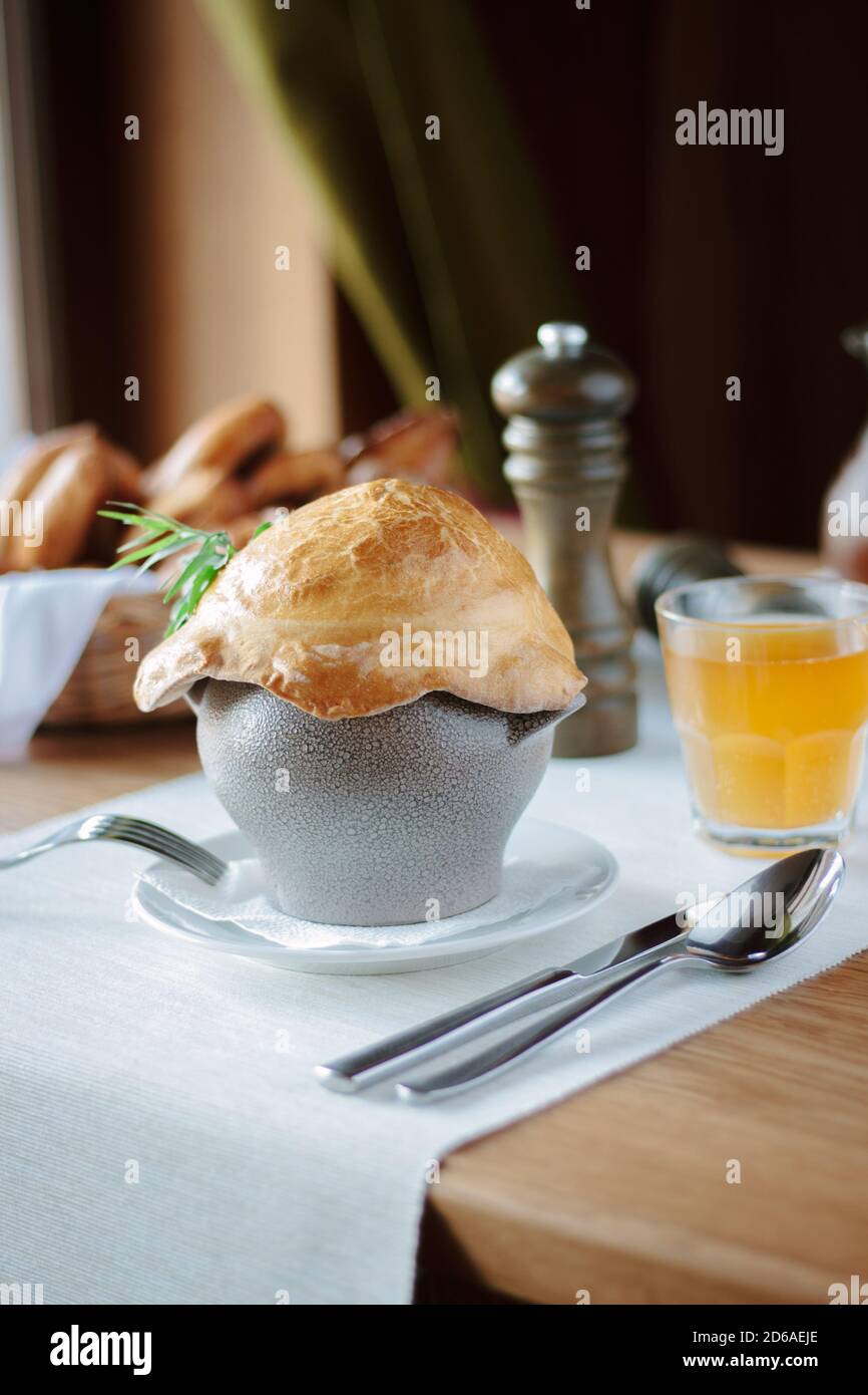 Traditional russian soup baked in an oven with bread as a cap Stock ...