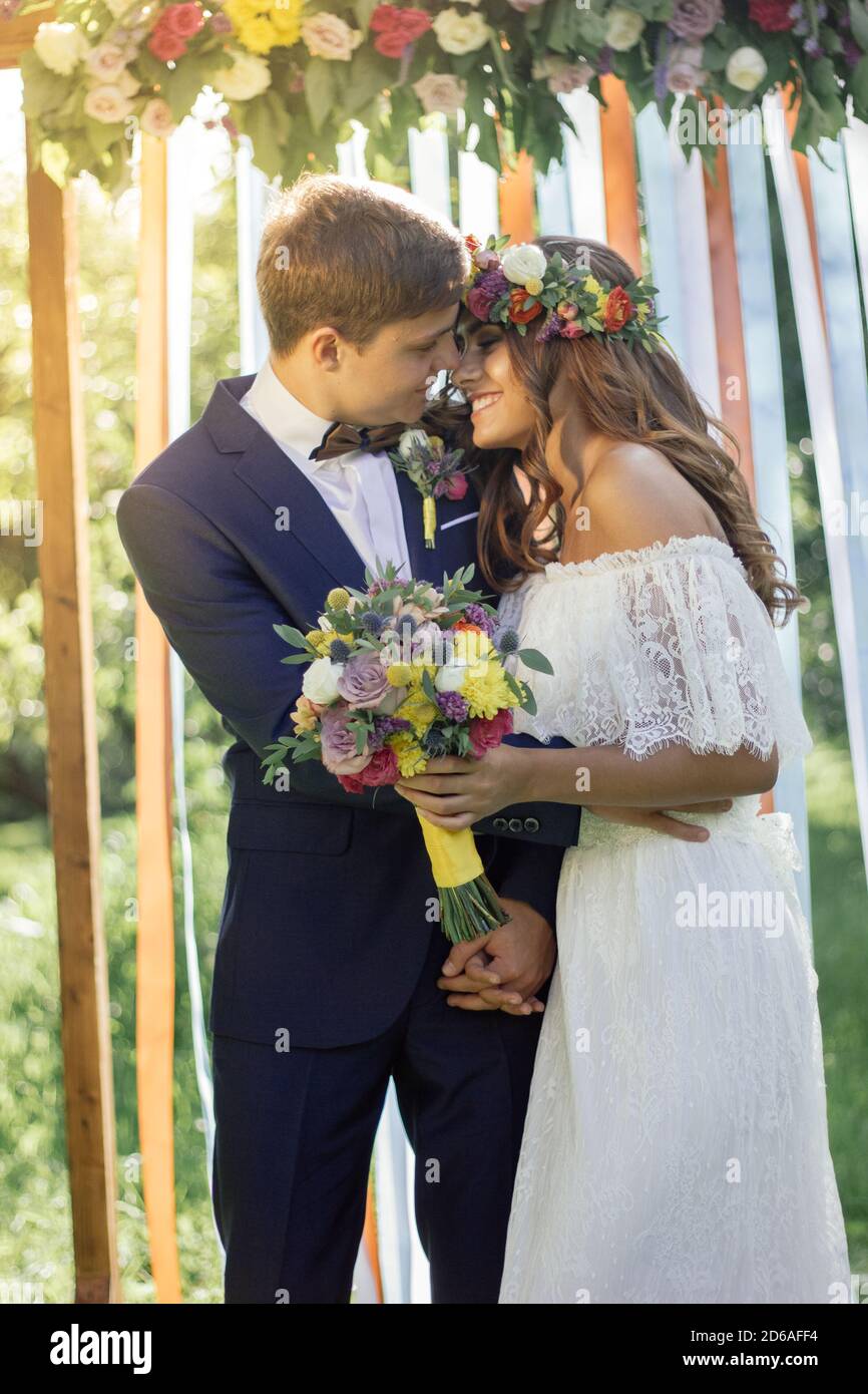 Beautiful wedding couple - bride and groom during wedding ceremony ...