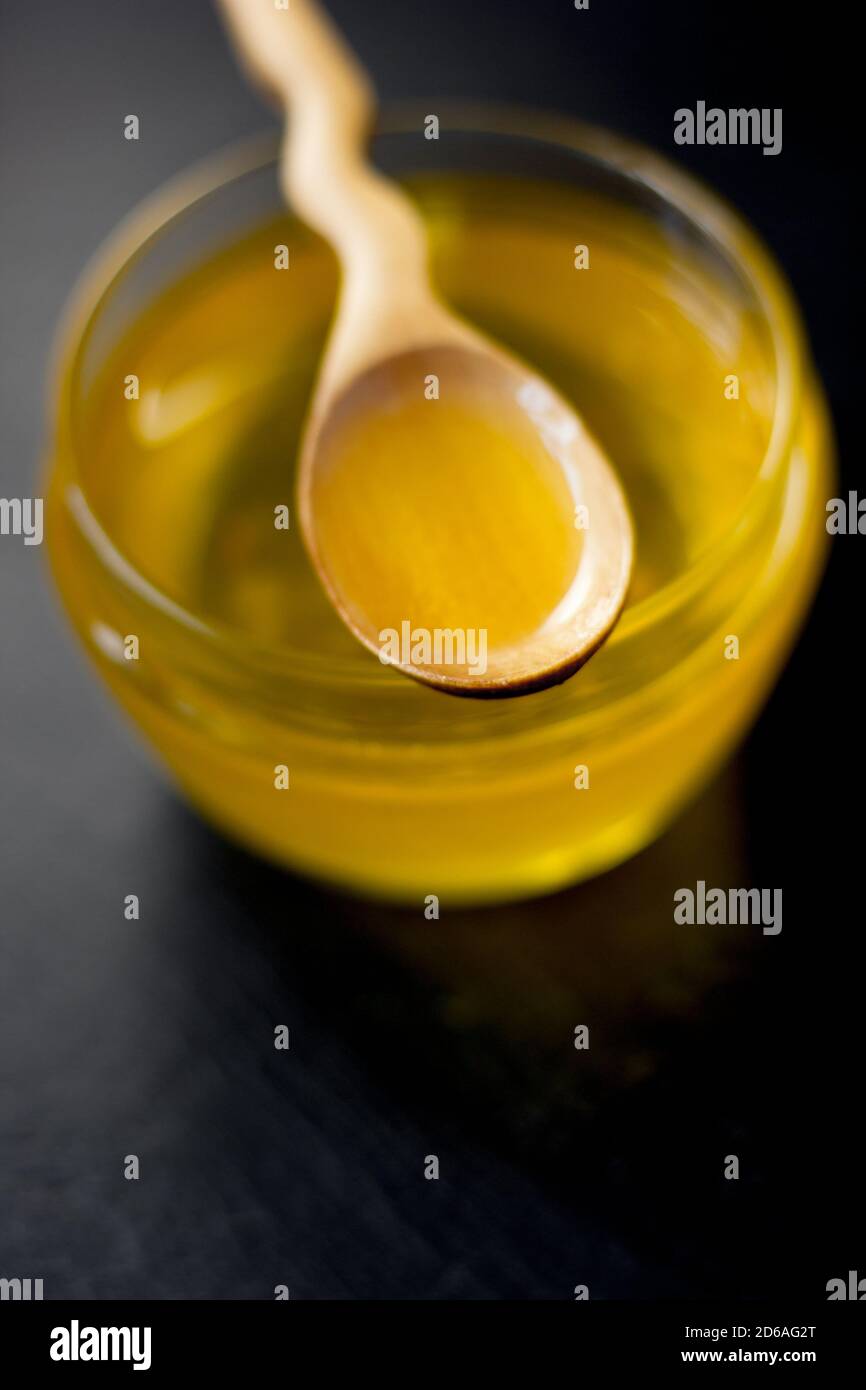 Indian ghee in a transparent glass bowl Stock Photo - Alamy