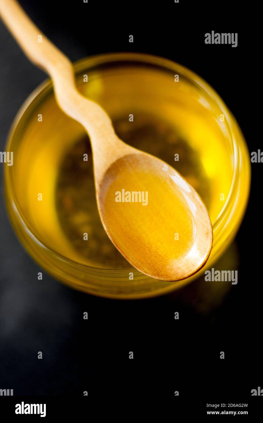 Desi ghee in wooden spoon hi-res stock photography and images - Alamy