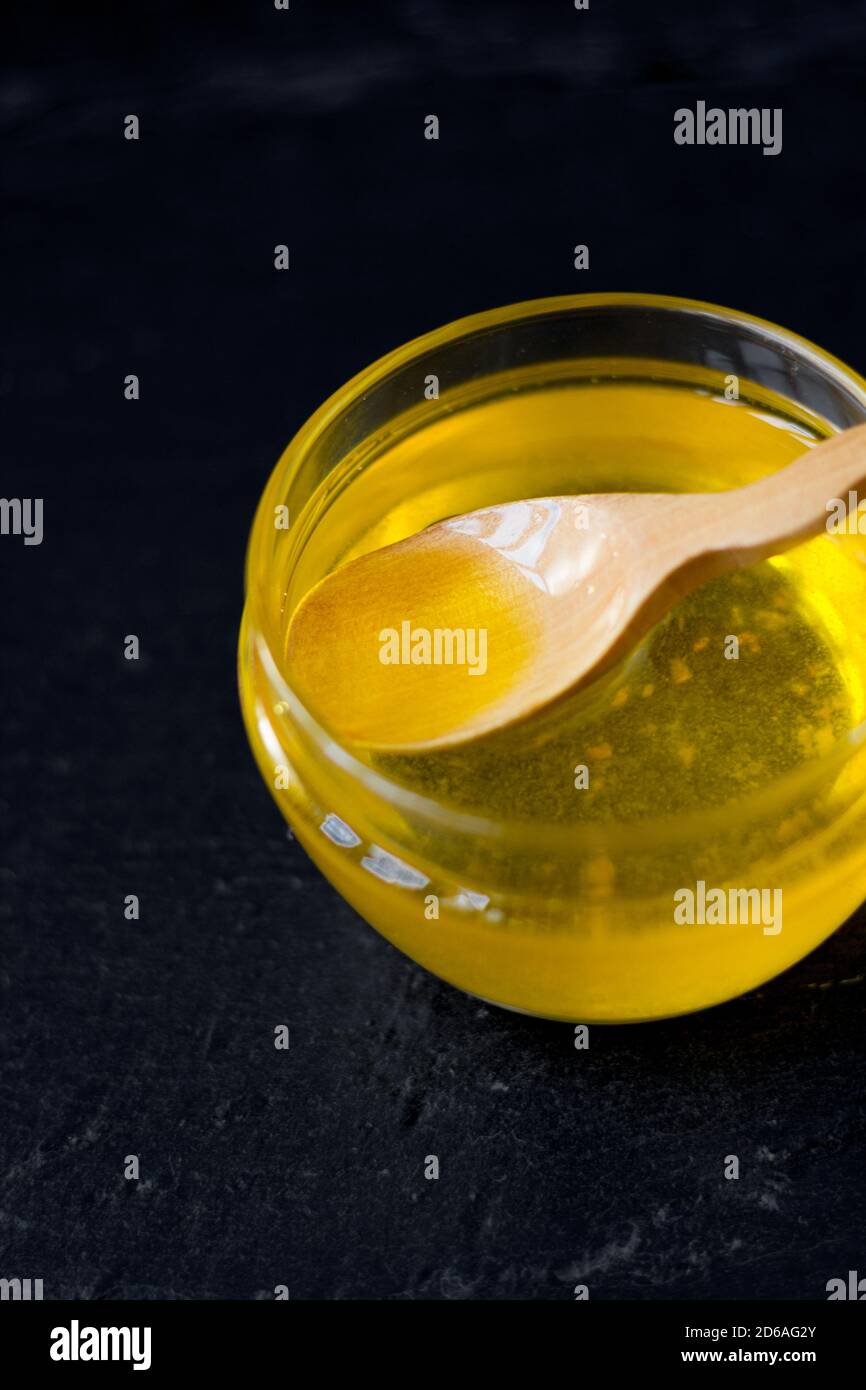 Indian ghee in a transparent glass bowl Stock Photo - Alamy