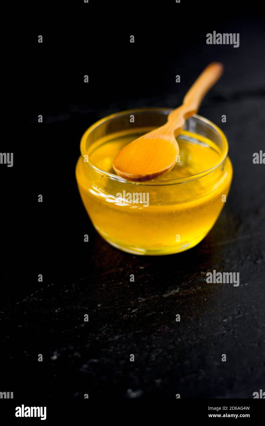 Indian ghee in a transparent glass bowl Stock Photo - Alamy