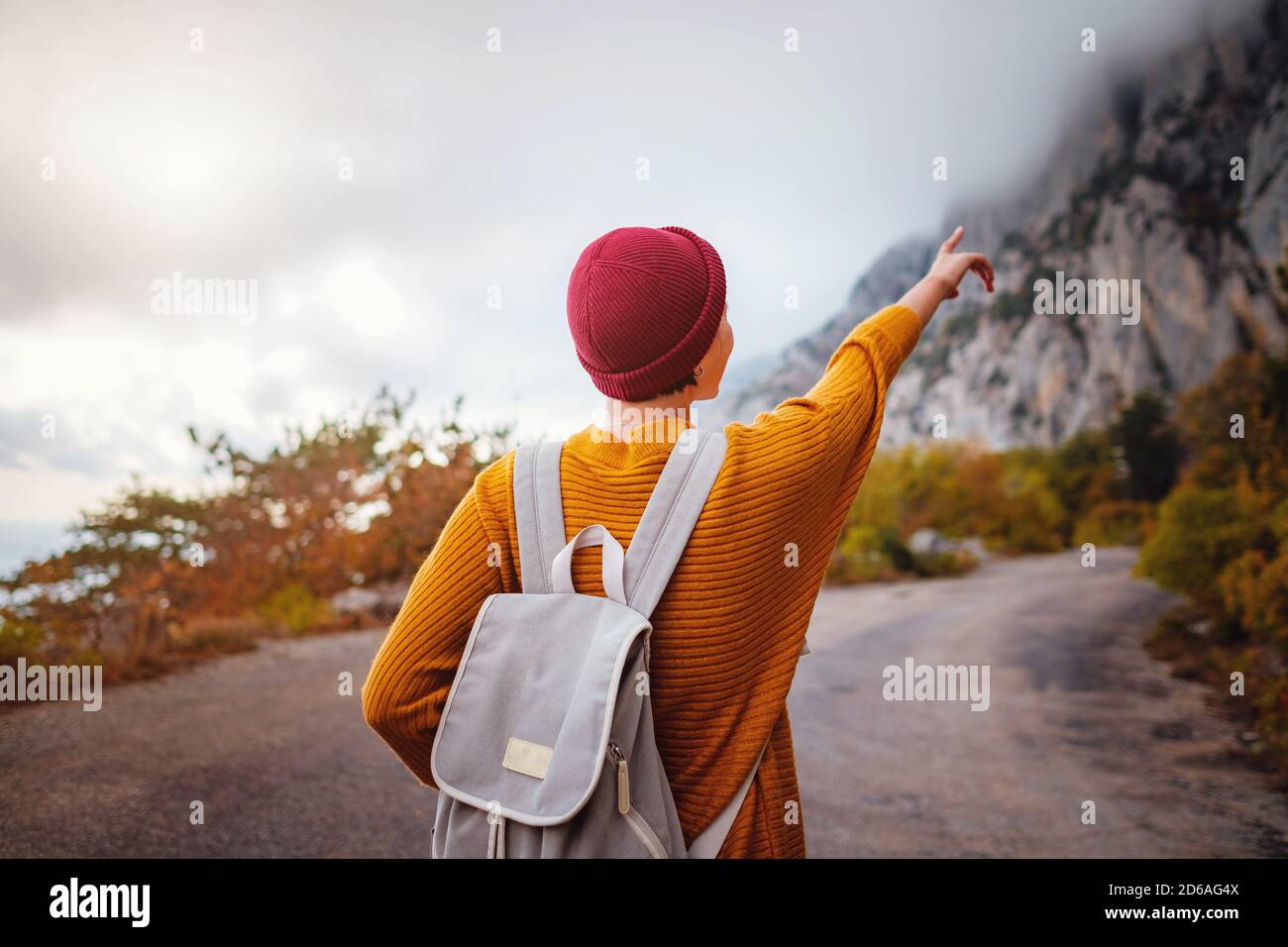 Outdoor fashion photo of young beautiful asian lady surrounded autumn ...