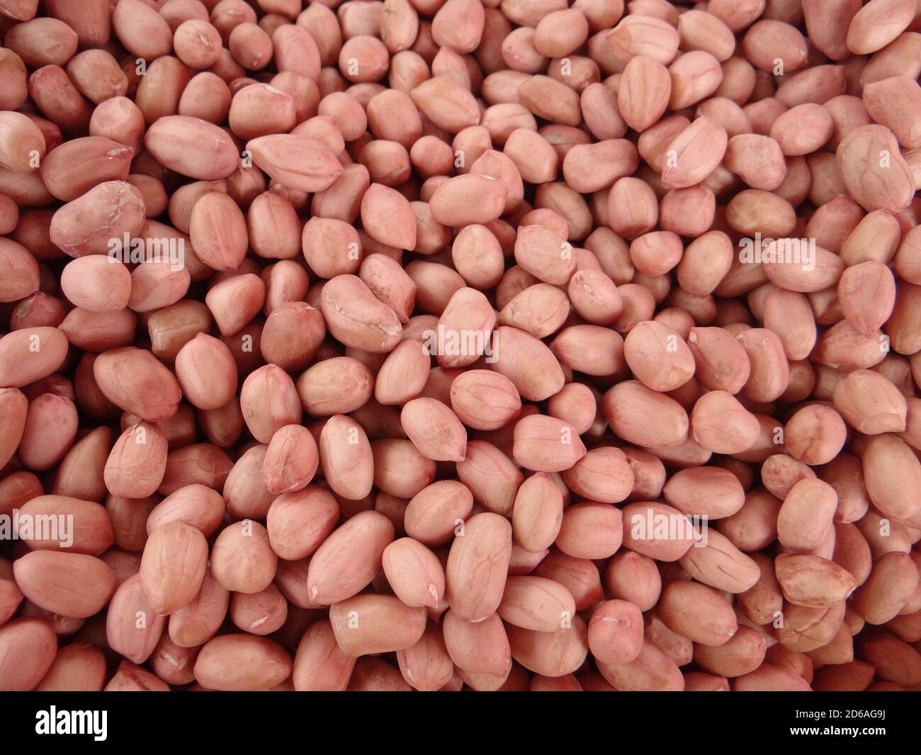 Macro of red peanuts Stock Photo - Alamy