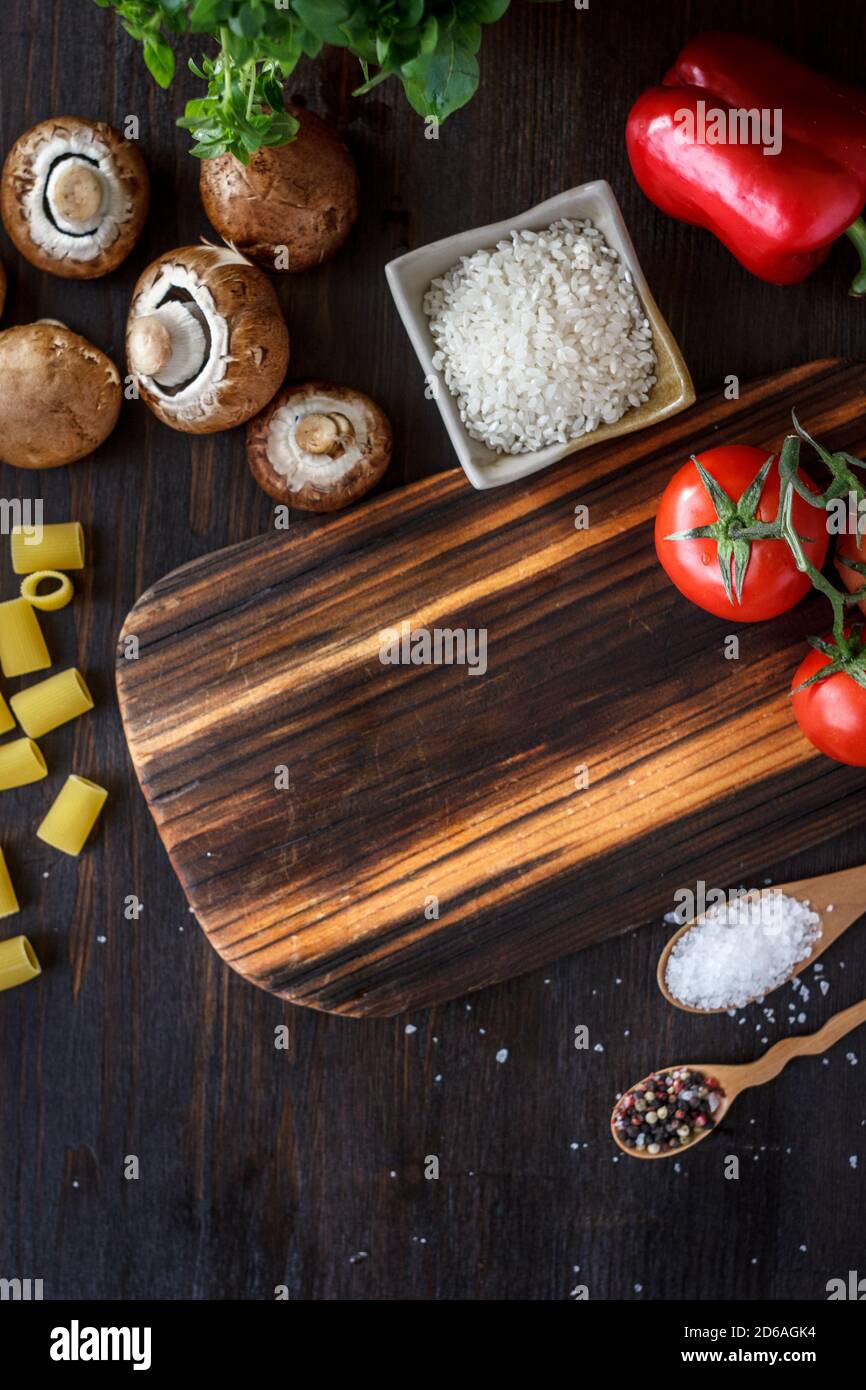 kitchen board with vegetables and spices around. Place for your text ...