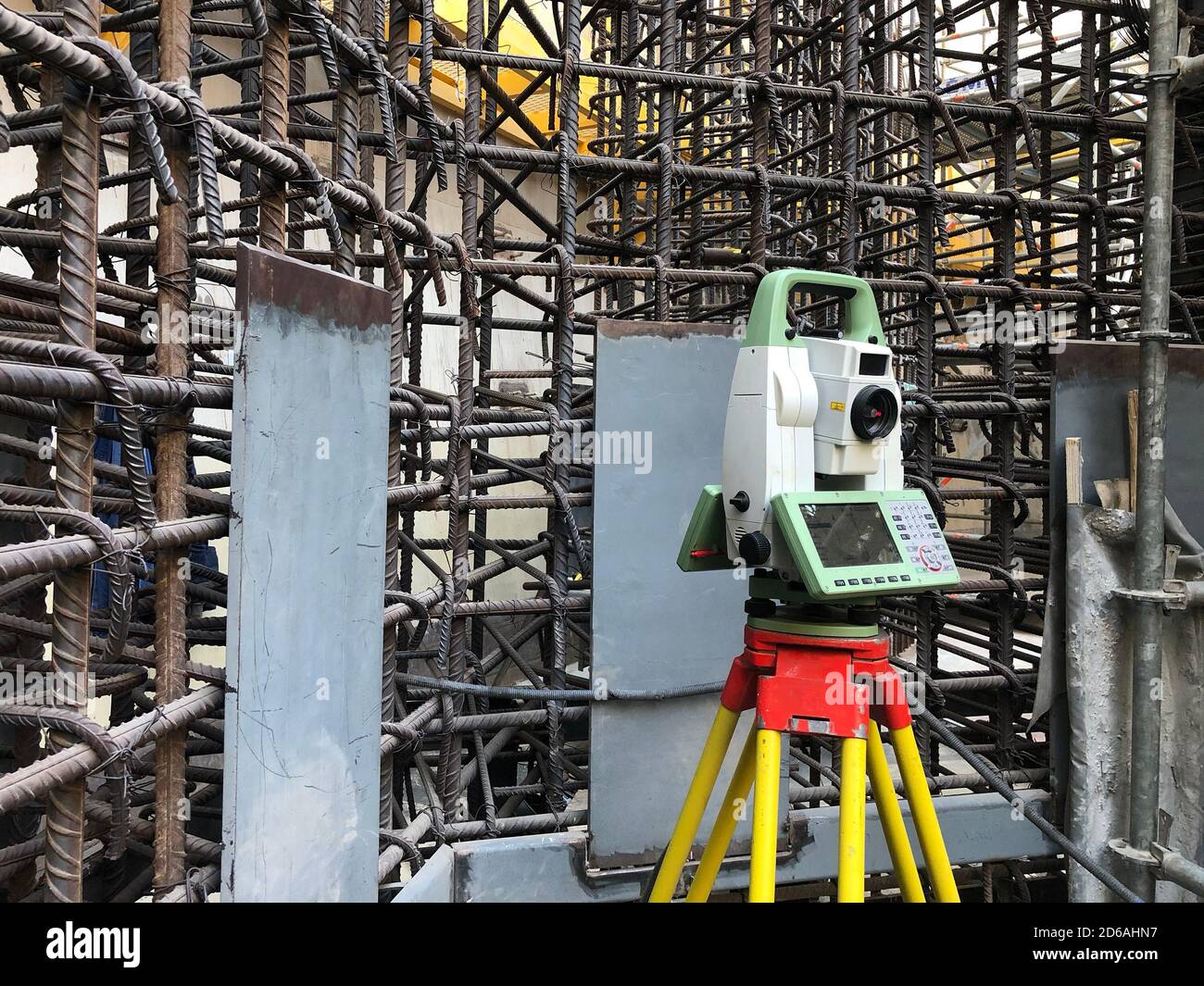 Geodetic total station at construction site. Survey equipment on tripod ...