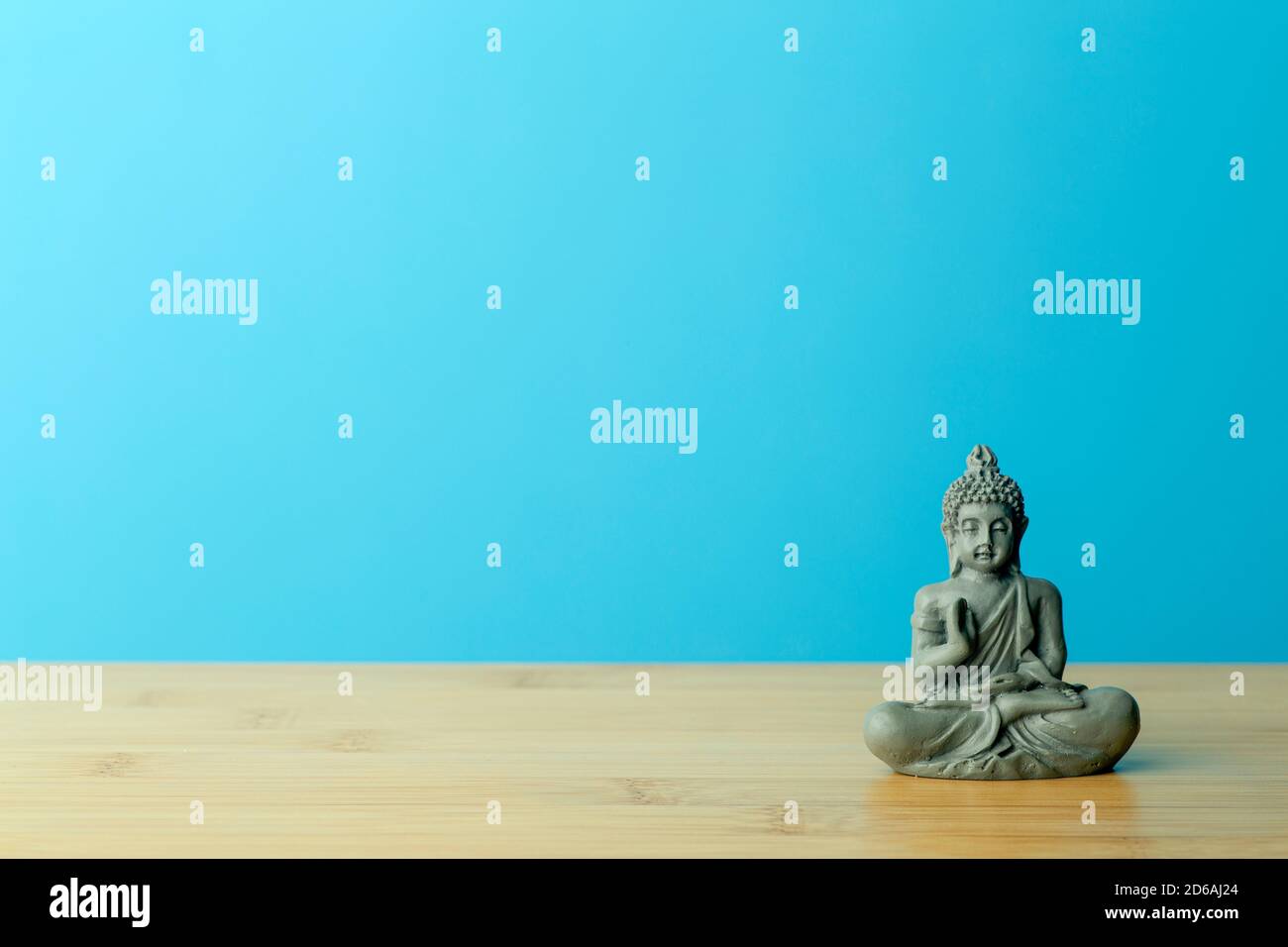 Zen, meditation and relaxation background. Buddha figurine on an empty ...