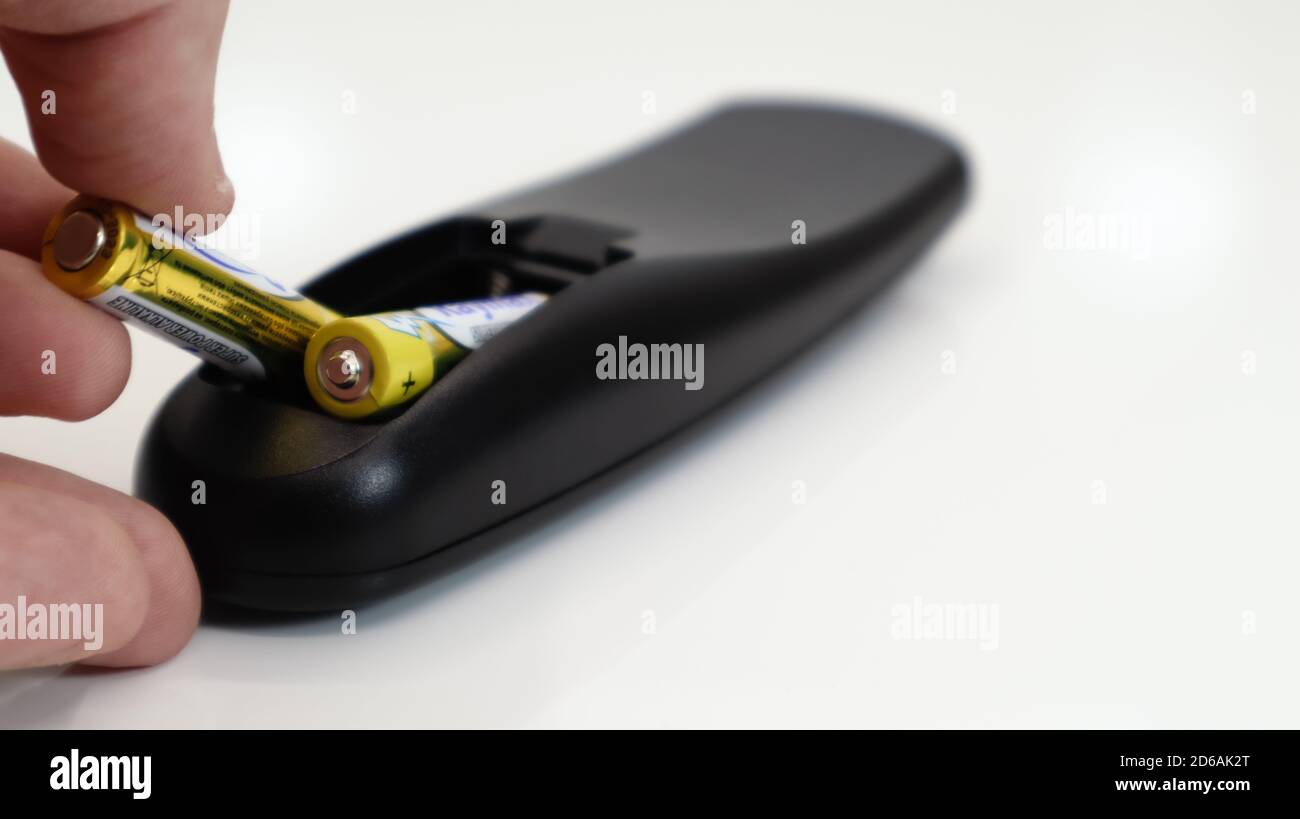 Insert the AAA size battery into the remote control. Installing ...