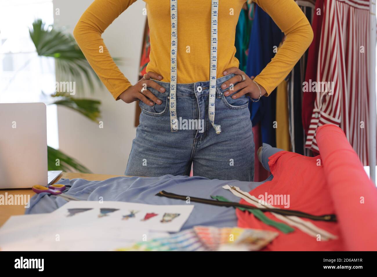 Mid section of female fashion designer at studio Stock Photo - Alamy