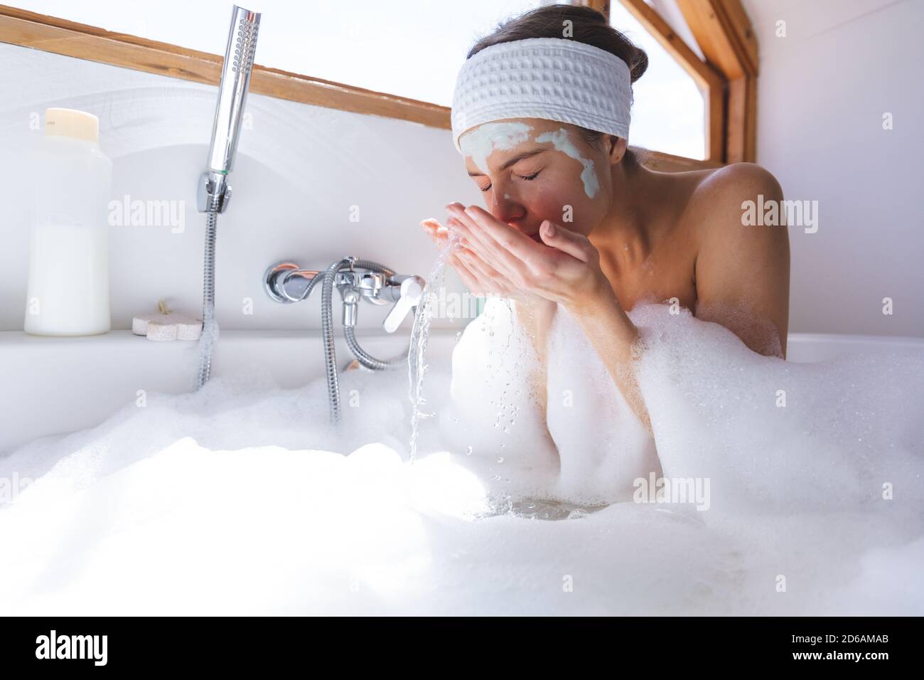 Woman washing face mask hi-res stock photography and images - Alamy