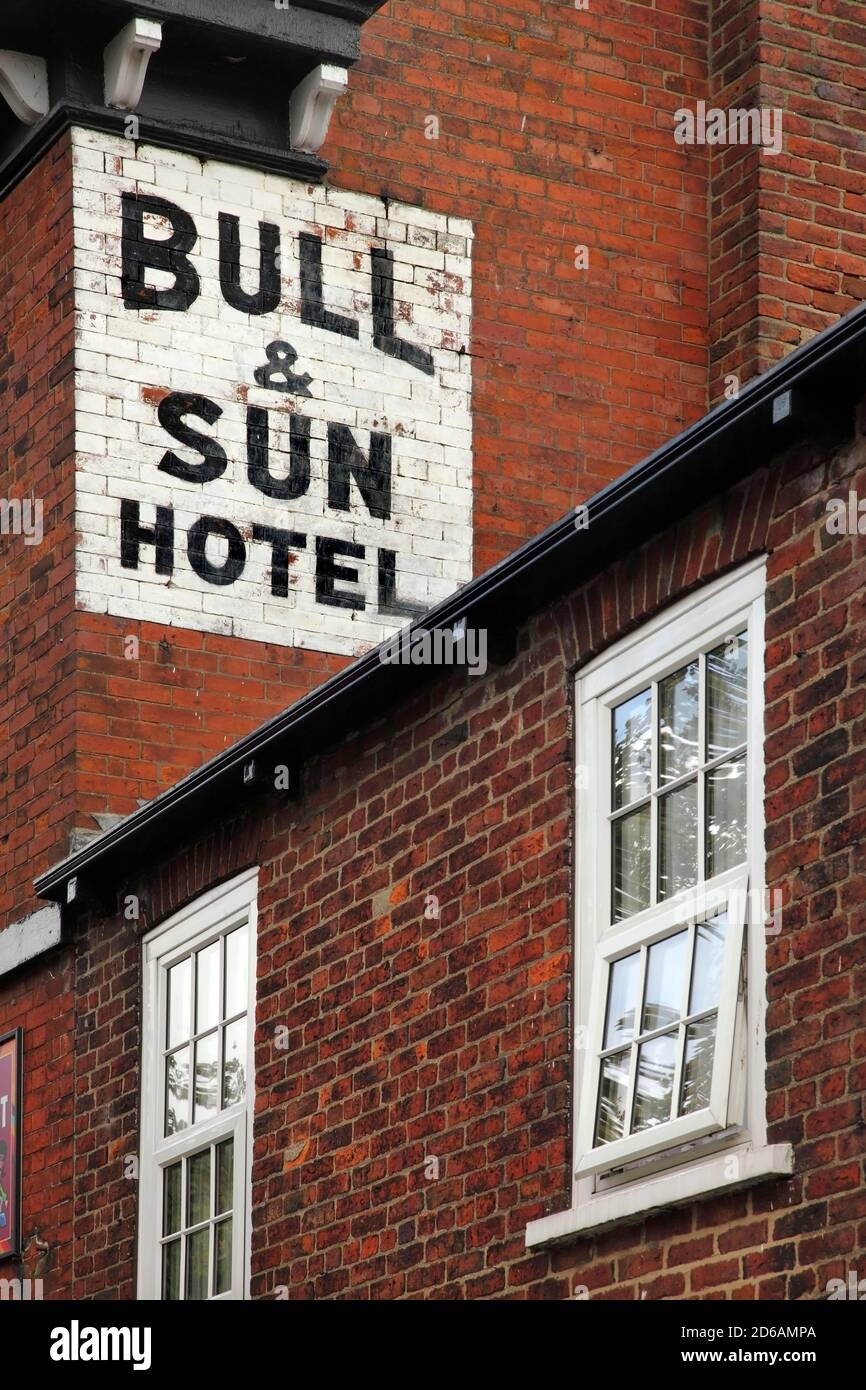 Sign on the side of the Bull and Sun Hotel and public house ...