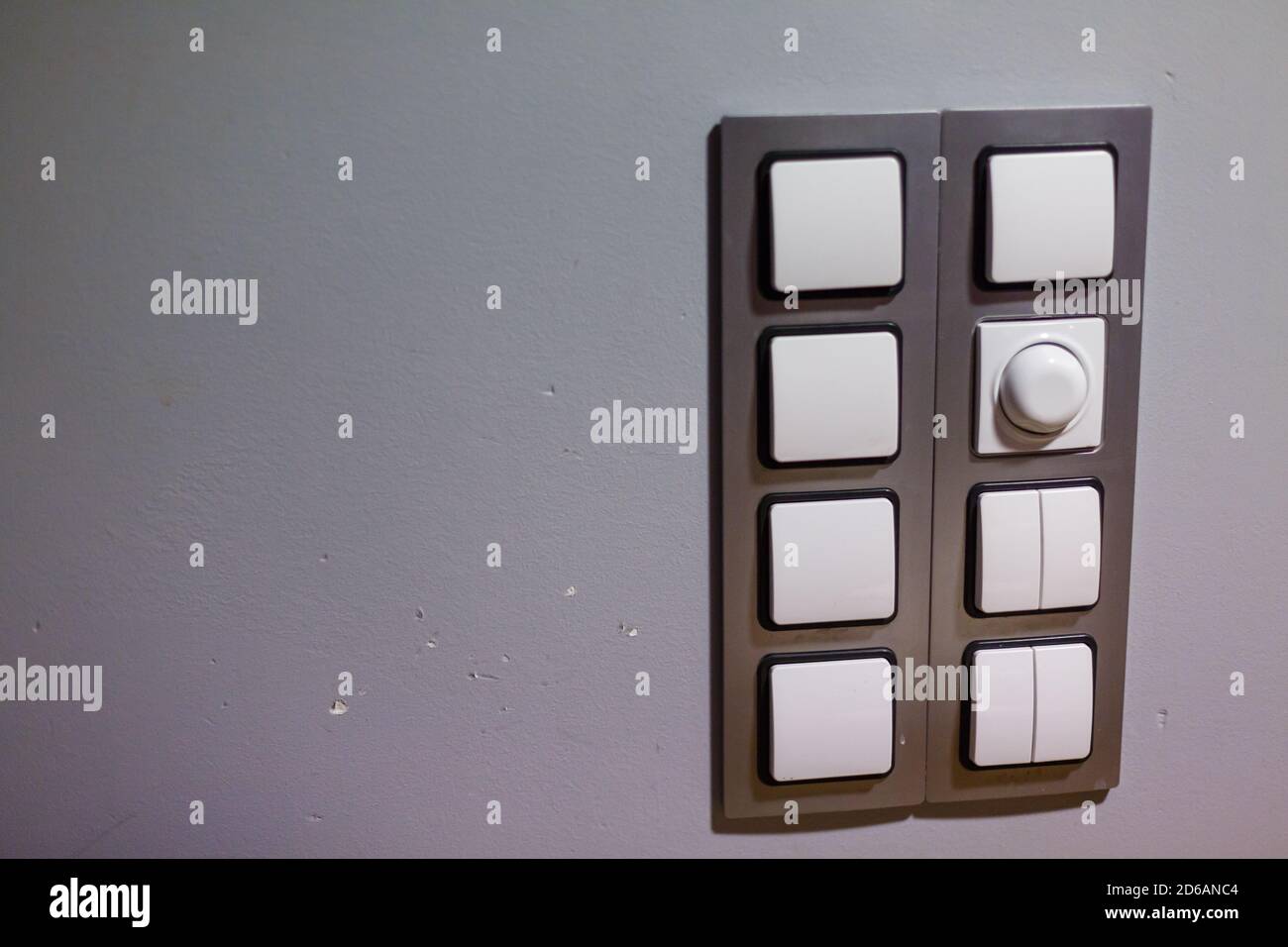 Set of modern lightswitch on grey wall. Electronic light switch. Smart ...
