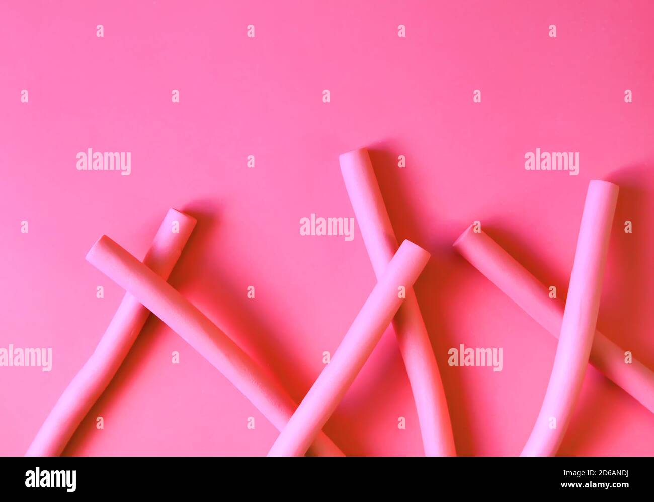 Pink foam curlers on soft pastel background. Hair accessories Stock ...