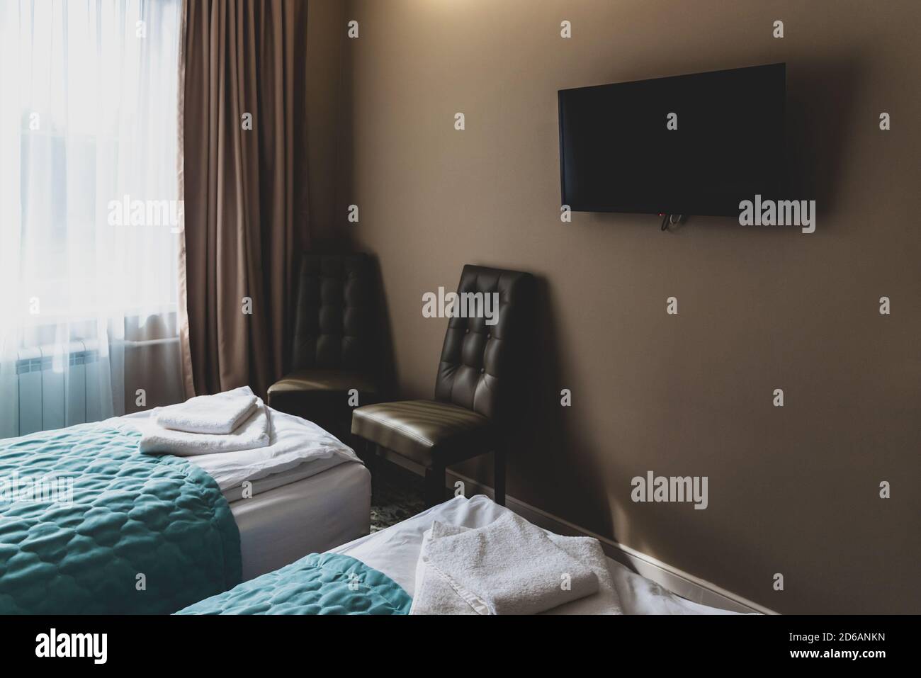 Hotel or hostel room, bedroom interior resign Stock Photo - Alamy