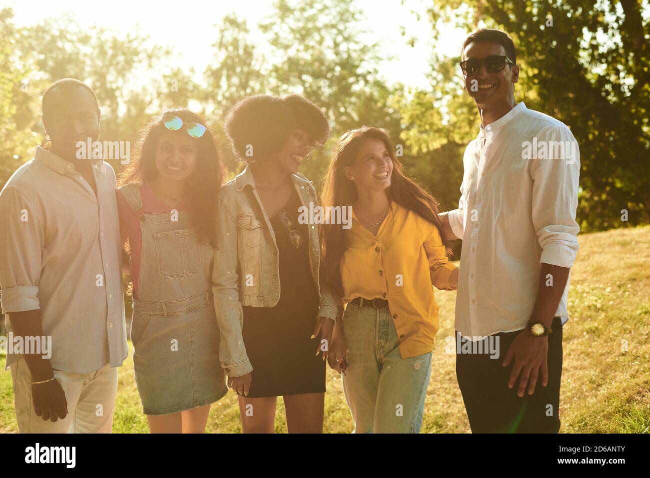 Group of happy friends having fun outdoor. Young diverse culture people ...