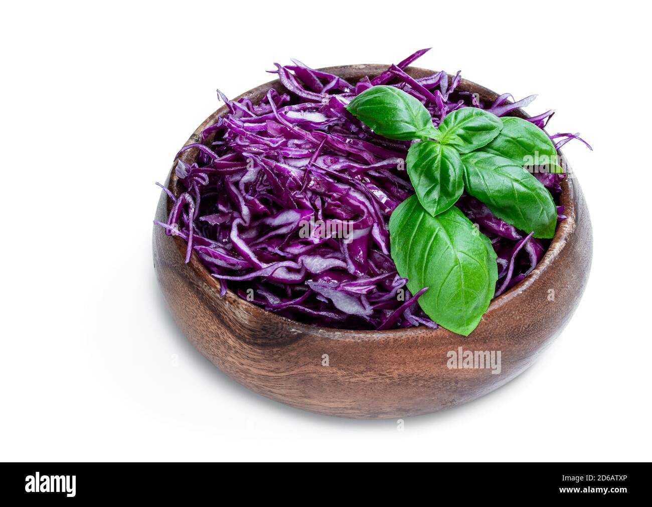 Sliced red cabbage in wooden bowl isolated on white Stock Photo - Alamy