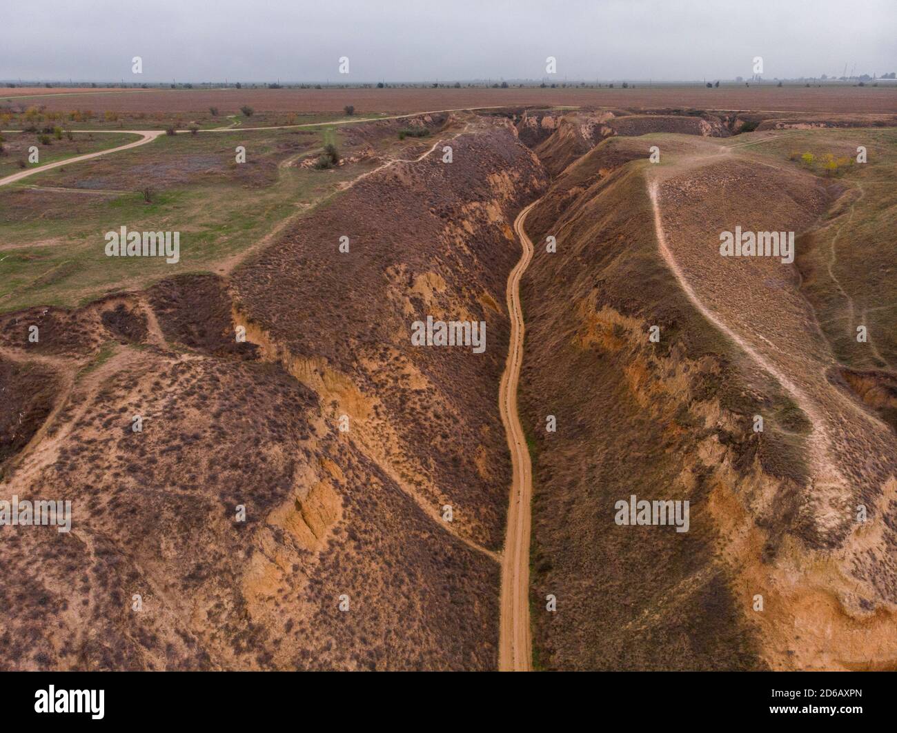 Aerial Shot of clay hills with canyons near the Black sea at Misty ...