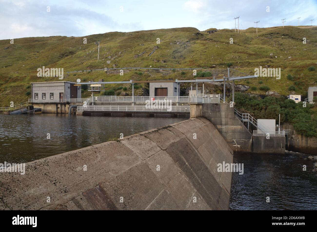 A concrete weir wall and power station on the River Cassley, part of ...